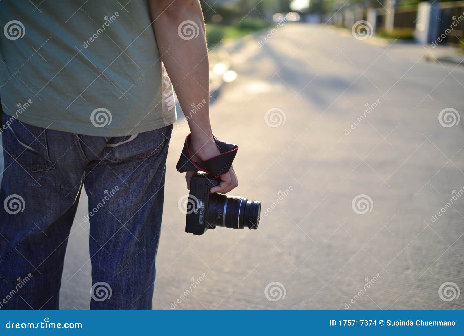 The View from the Back of a Professional Photographer Stand Holding His ...