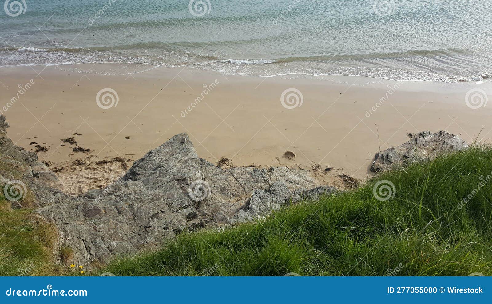 Beach view from cliff edge stock photo. Image of rock - 277055000