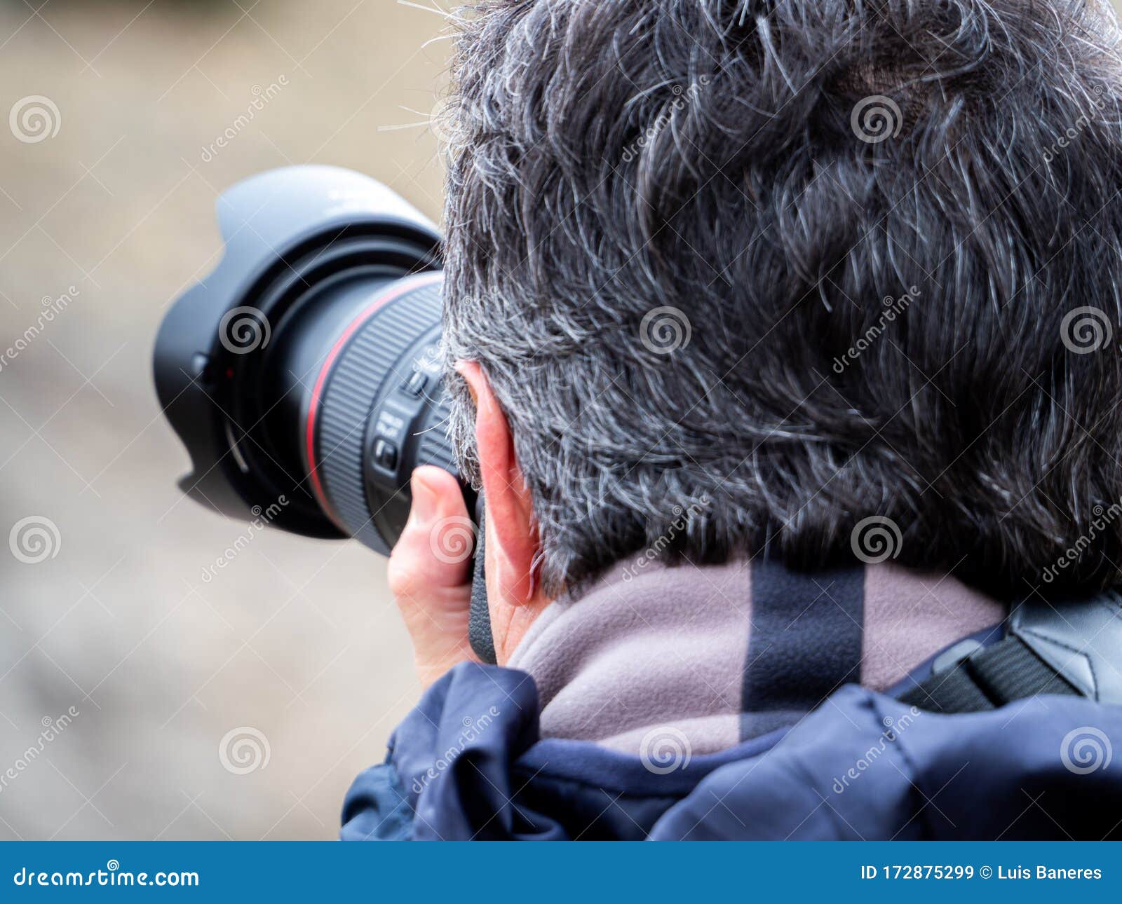 View from Behind of a Man Taking a Photograph with a Camera Stock Image ...