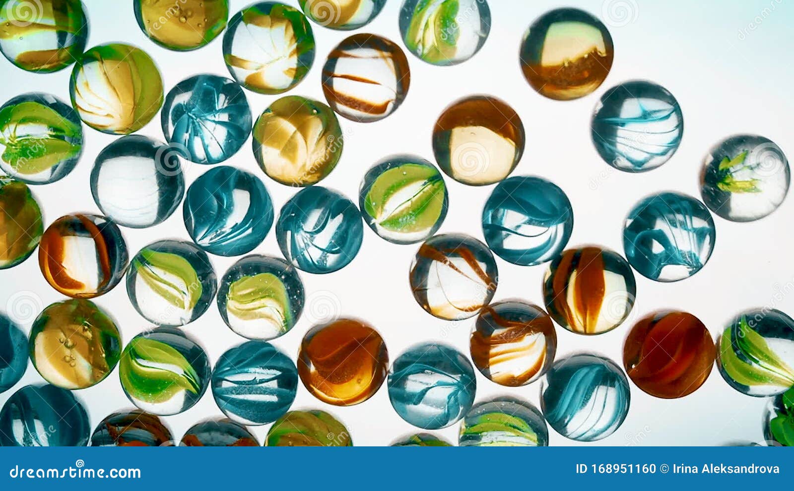 View from Below As the Hand Throws Small Multi-colored Colored Plastic ...