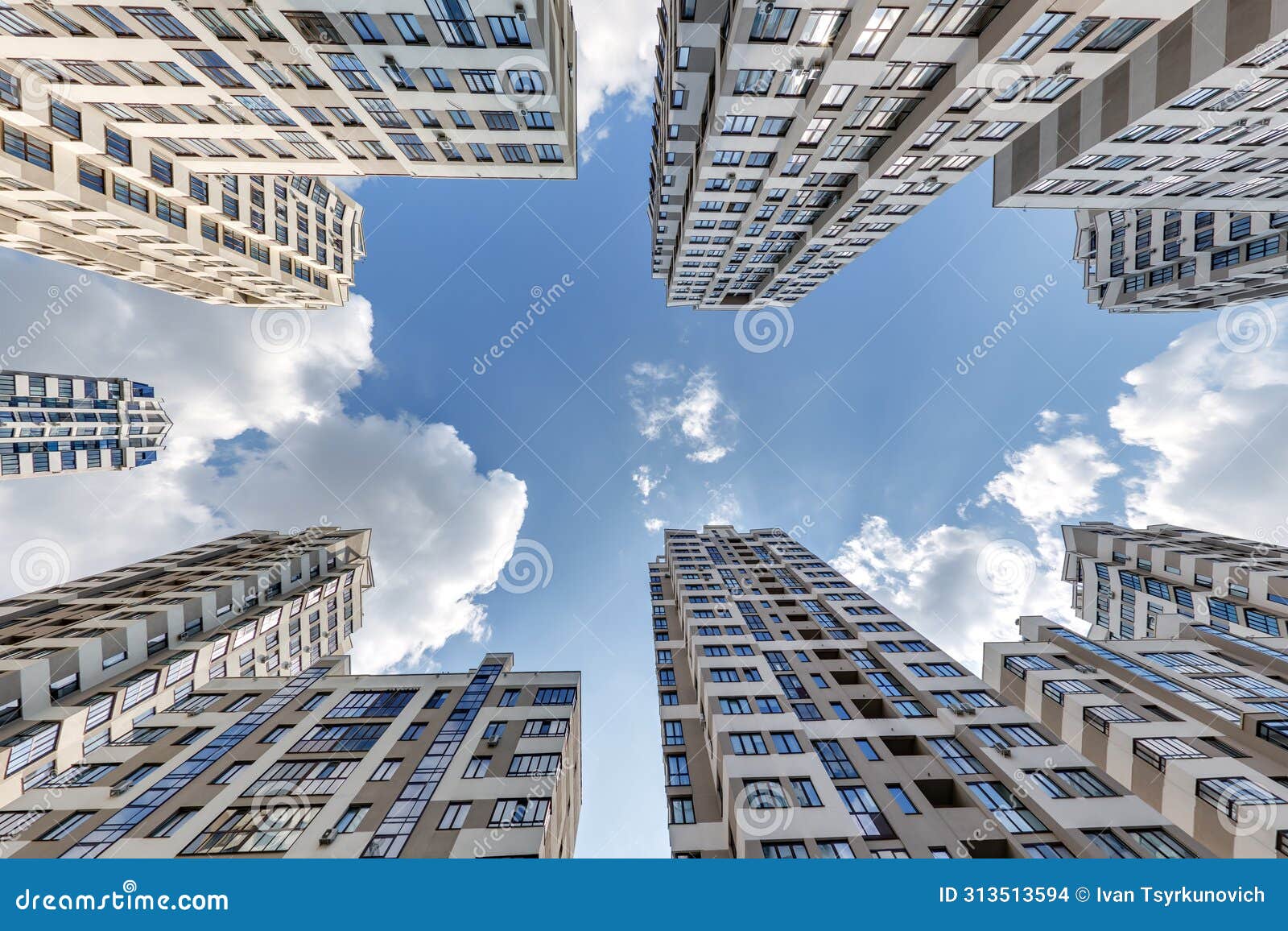 View from Below into Blue Sky with Clouds of Large Modern Skyscraper ...
