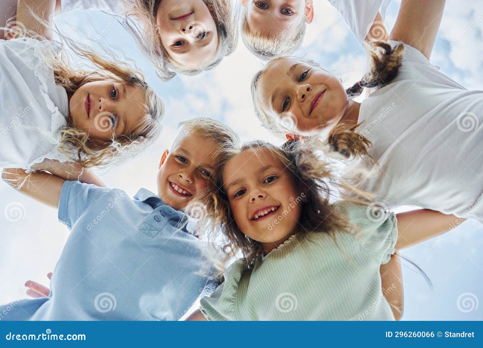 View from Below of Happy Kids that are Standing Together and Looking ...