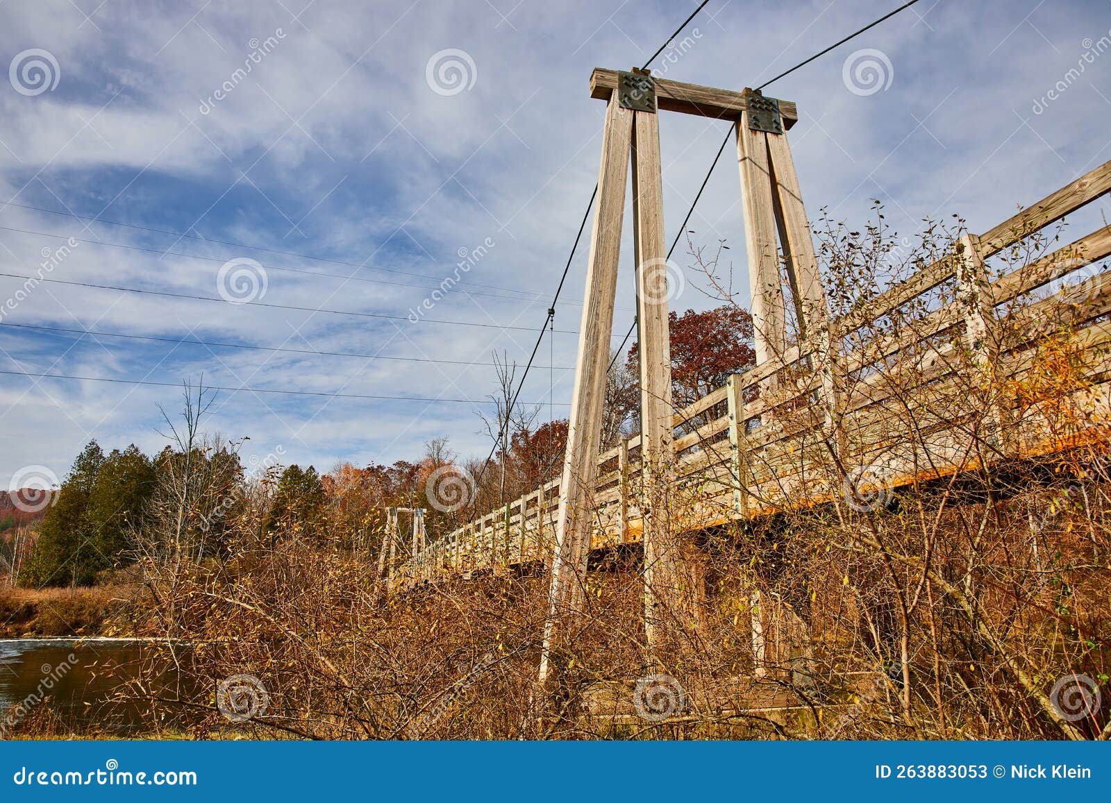 View Below Large Suspension Bridge Going Over River Near Fall Fields ...