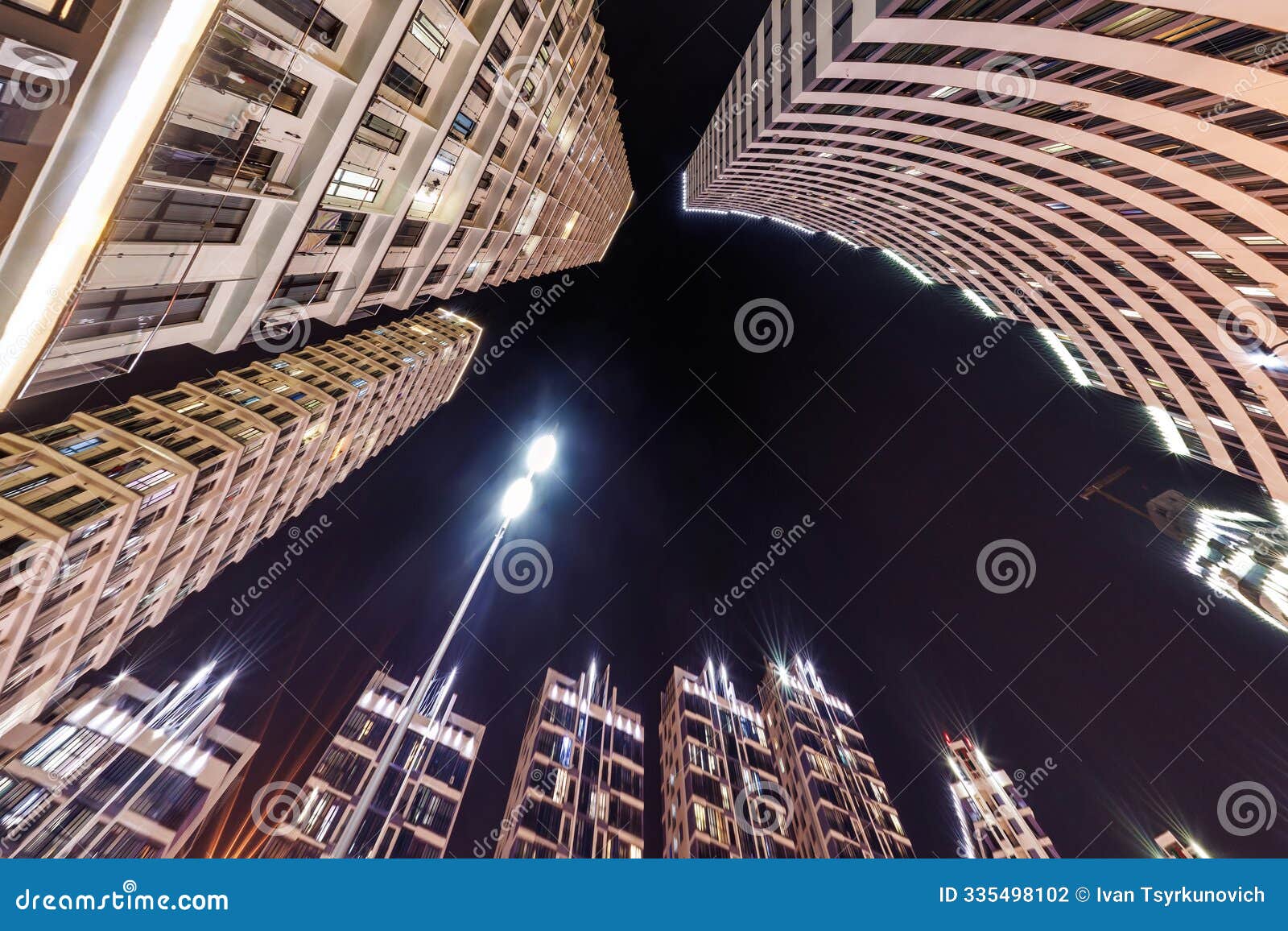 View from Below into Night Sky of Large Modern Skyscraper Residential ...