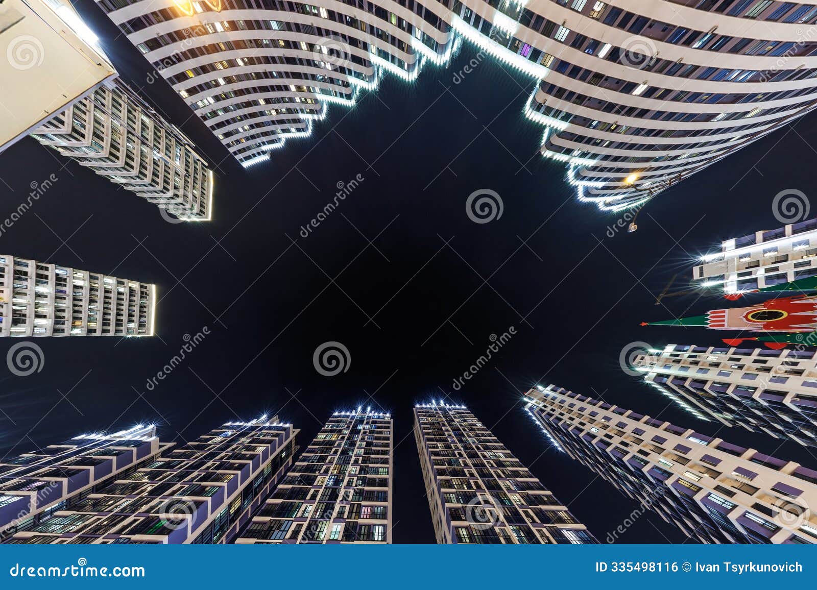 View from Below into Night Sky of Large Modern Skyscraper Residential ...
