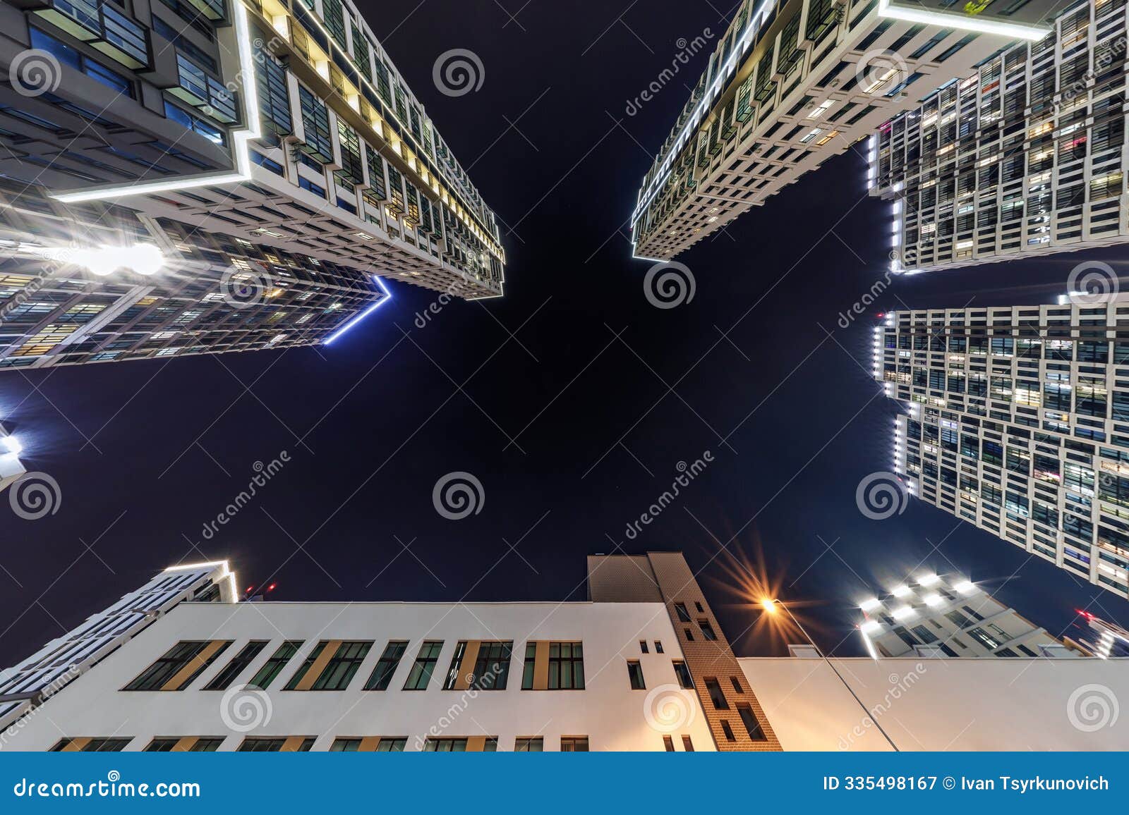 View from Below into Night Sky of Large Modern Skyscraper Residential ...