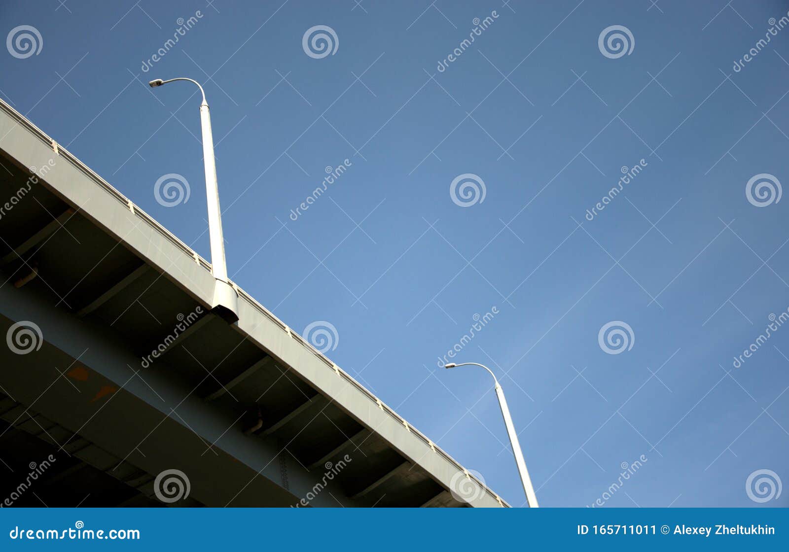 View from Below on a Part of the Bridge with Lighting Poles and Clear ...