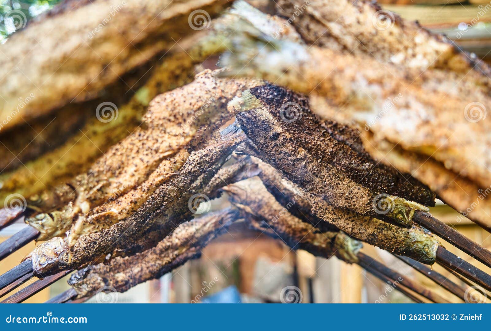 View from Below of Stockfish, Which are Trout Skewered on a Stick and ...