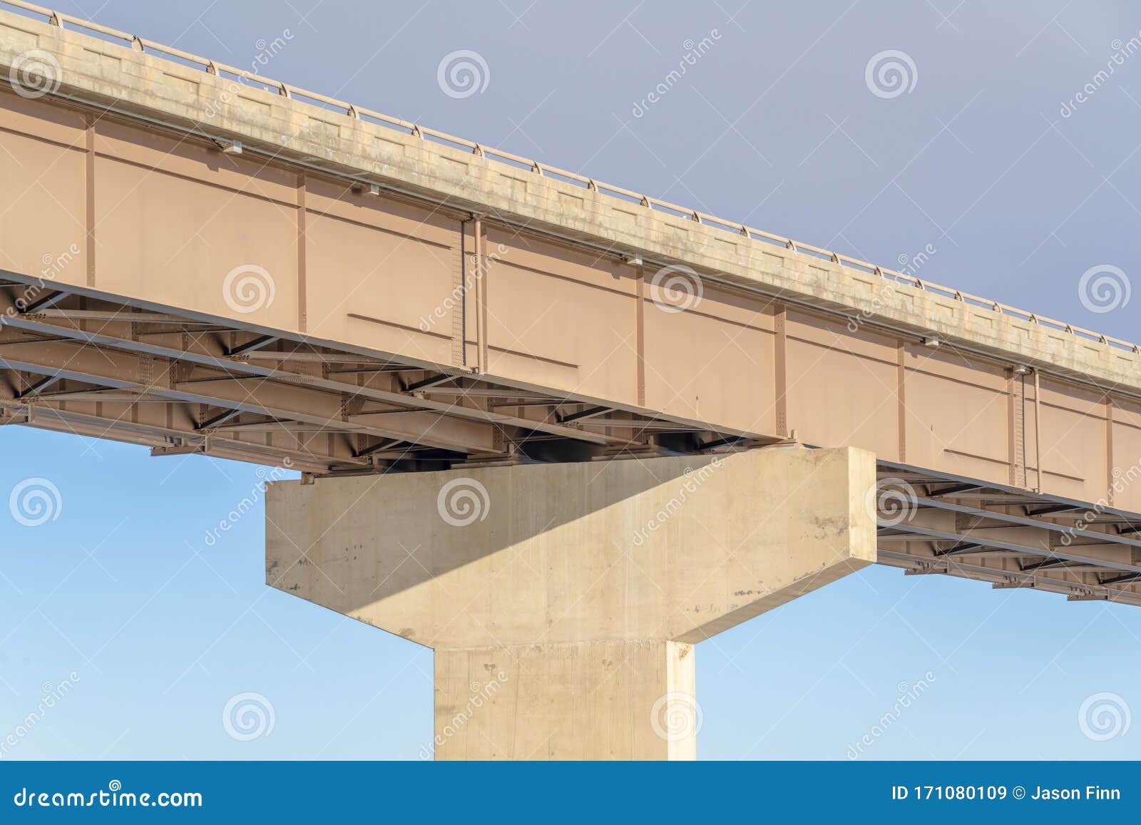 View Beneath a Stringer Bridge with Massive Abutment that Supports the ...