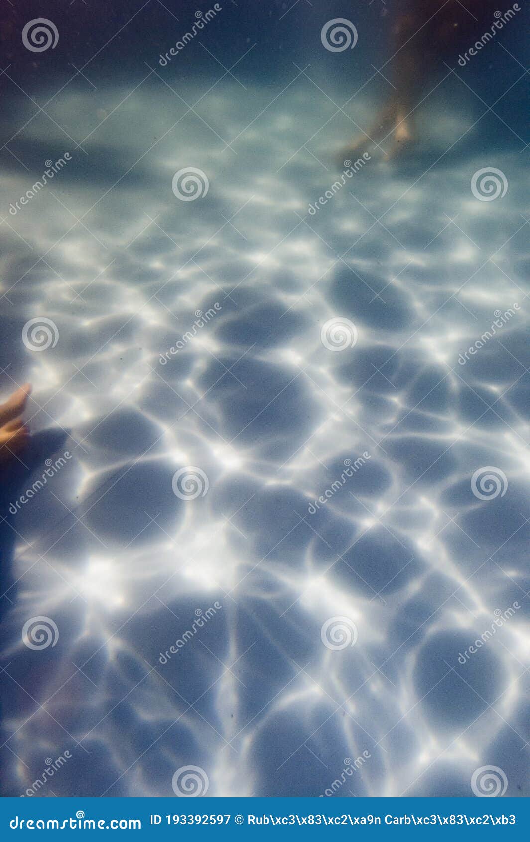 View of the Bottom of a Swimming Pool with a Rippled Light Effect Stock ...