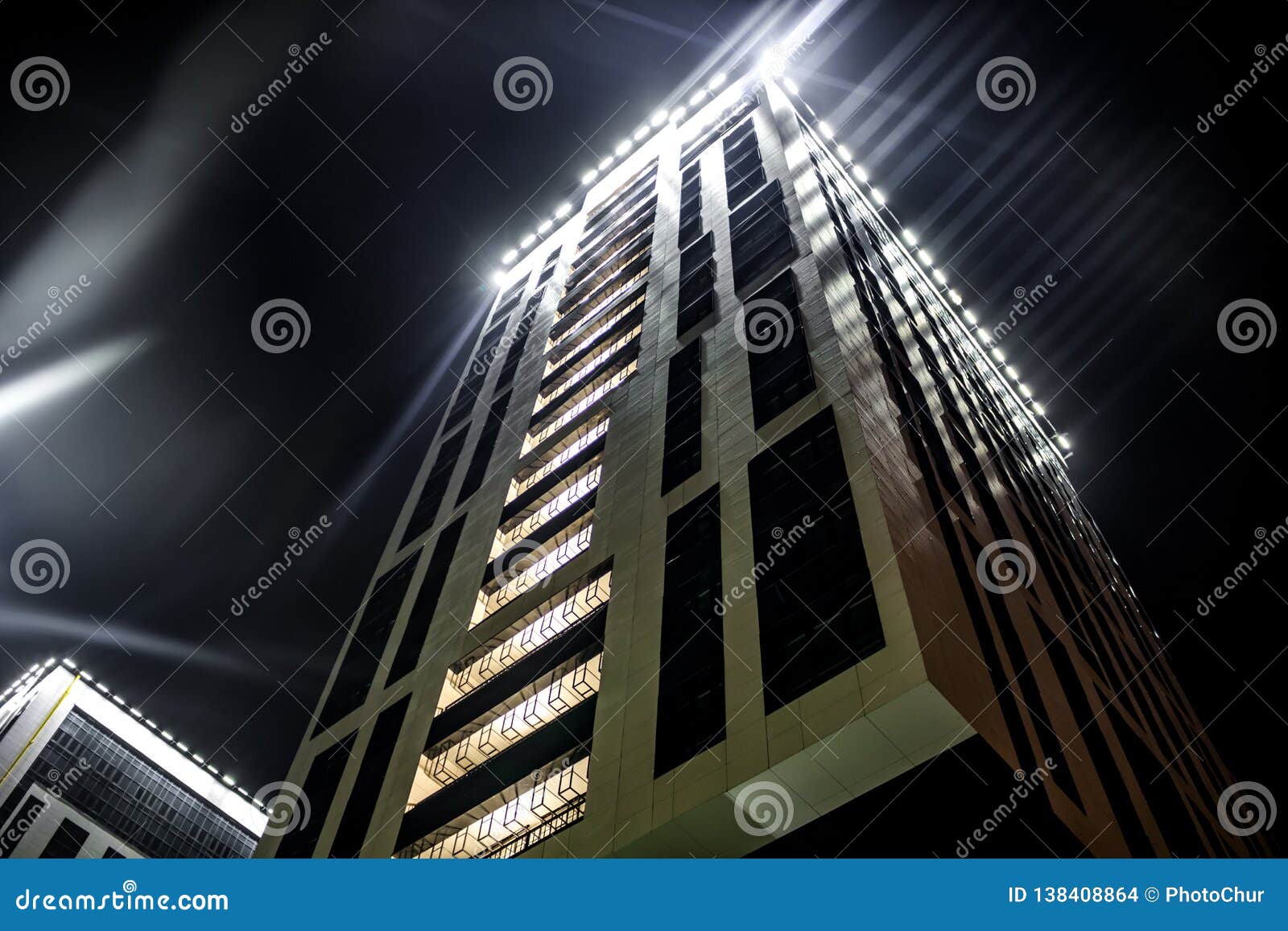 View Bottom Up on a Tall Modern Building at Night Stock Photo - Image ...