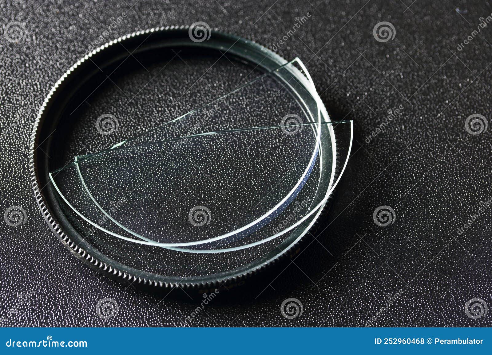 BROKEN GLASS of a LENS FILTER on a BLACK BACKGROUND Stock Photo - Image ...