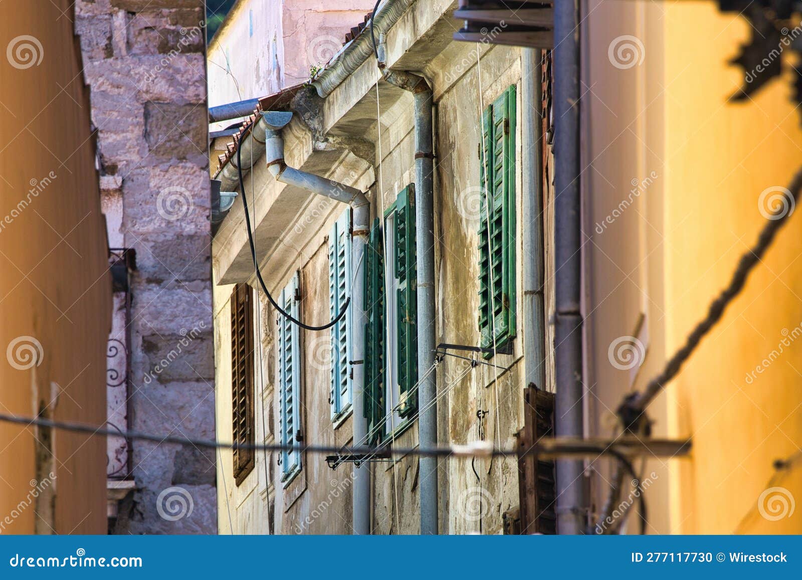 View of a Building from a Narrow Alley Way with Windows Stock Photo ...