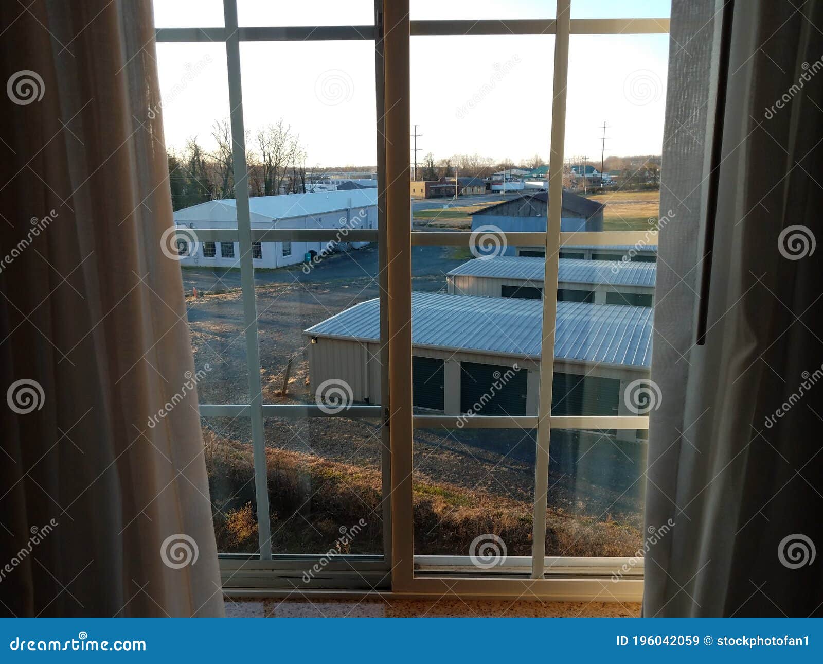 View of Buildings from Window with Curtains Stock Image - Image of view ...