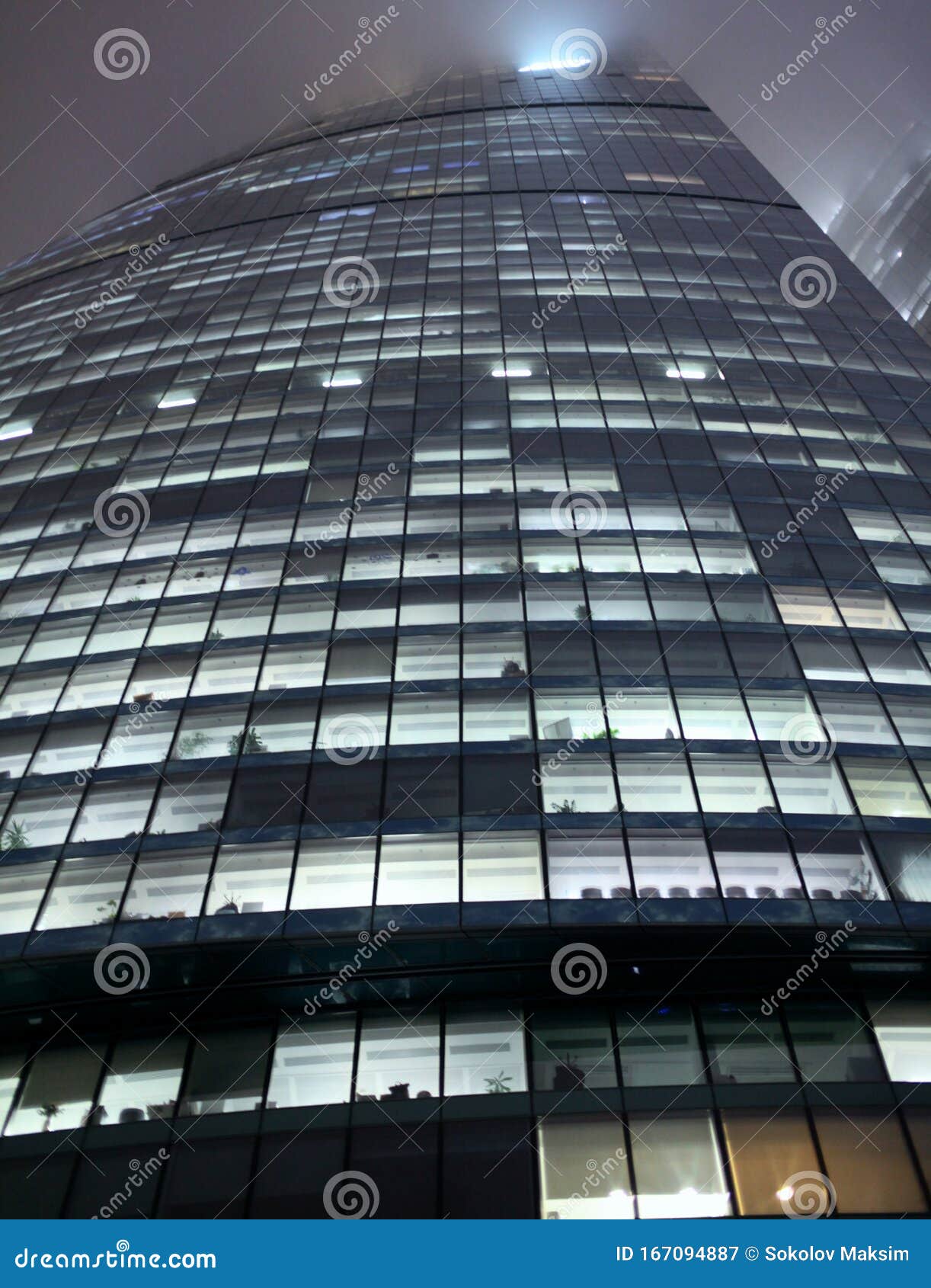 View of the Burning Windows of the Modern Office Building at Night. the ...