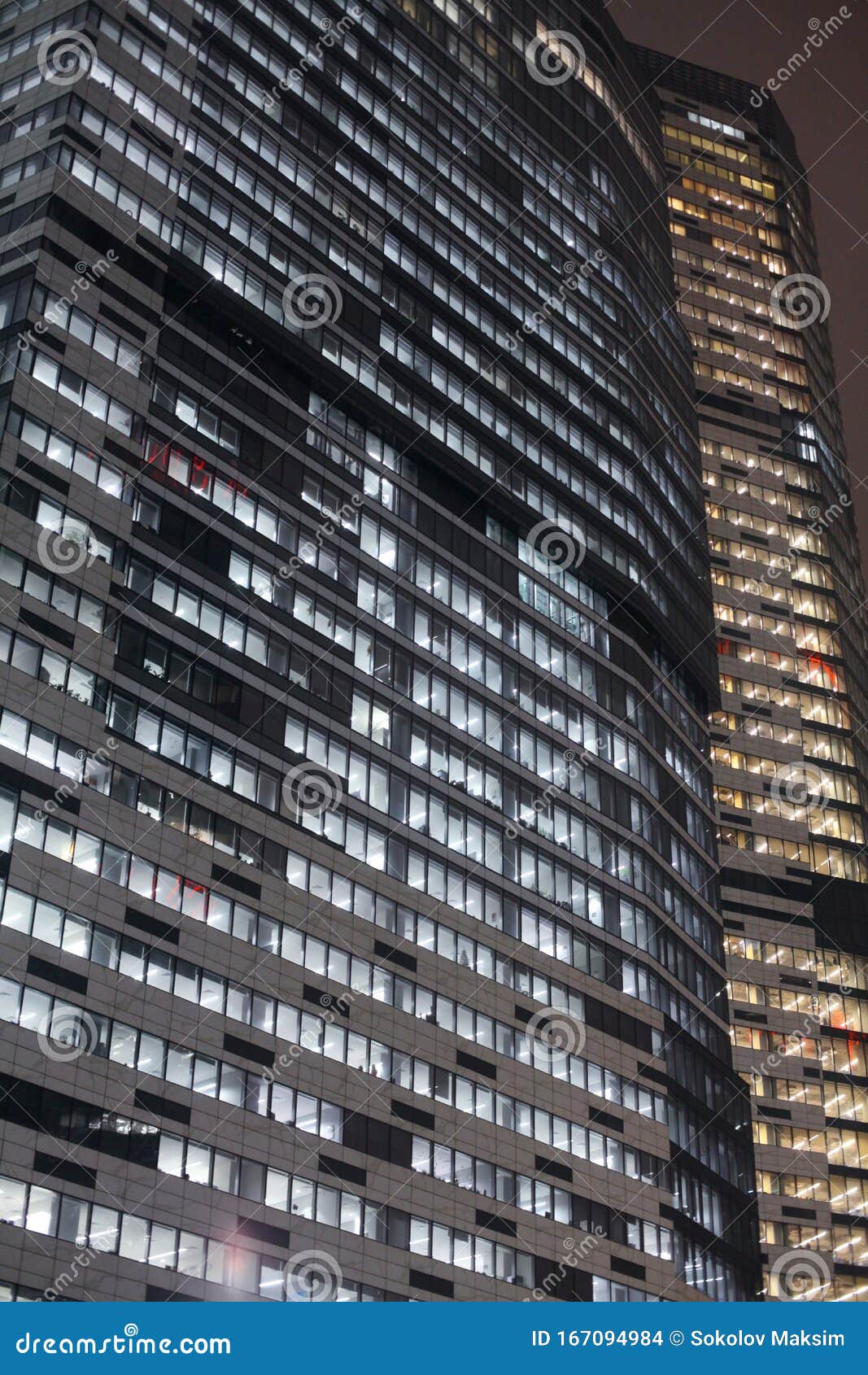 View of the Burning Windows of the Modern Office Building at Night. the ...