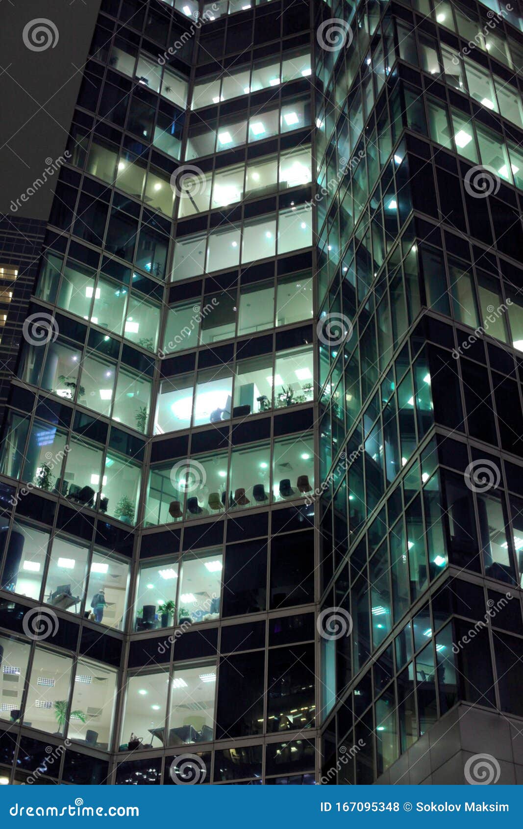 View of the Burning Windows of the Modern Office Building at Night. the ...