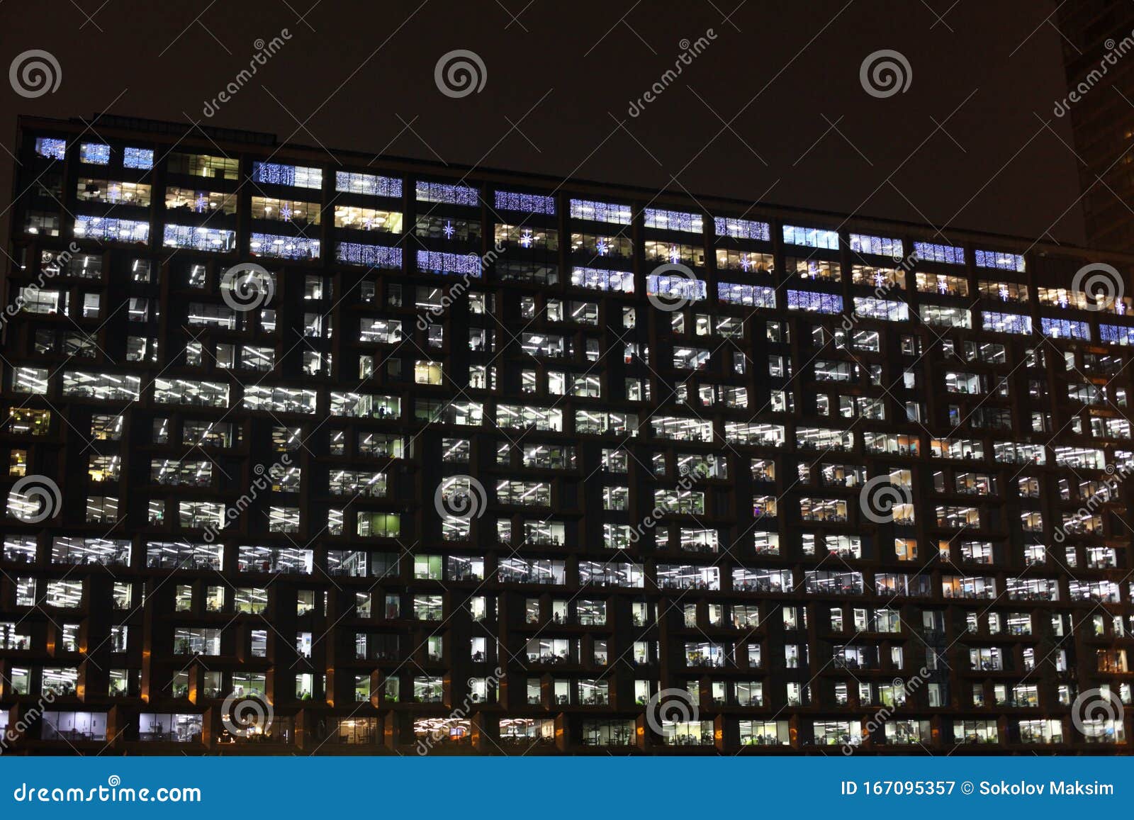 View of the Burning Windows of the Modern Office Building at Night. the ...
