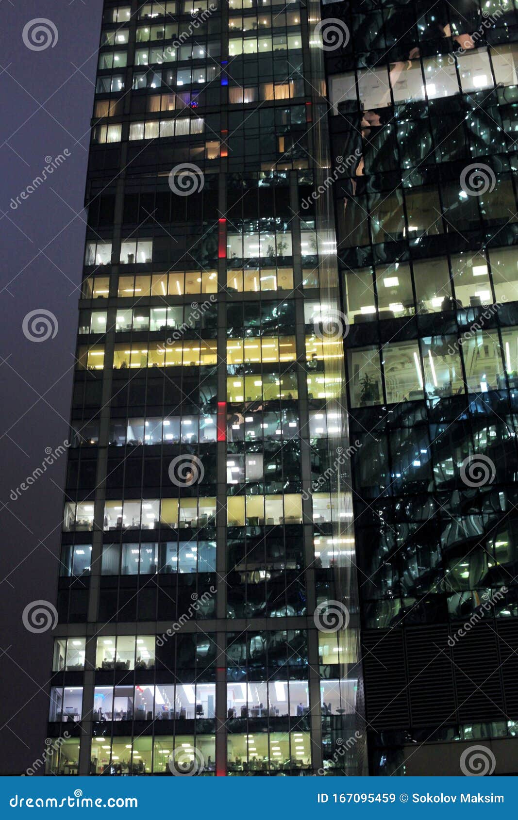 View of the Burning Windows of the Modern Office Building at Night. the ...