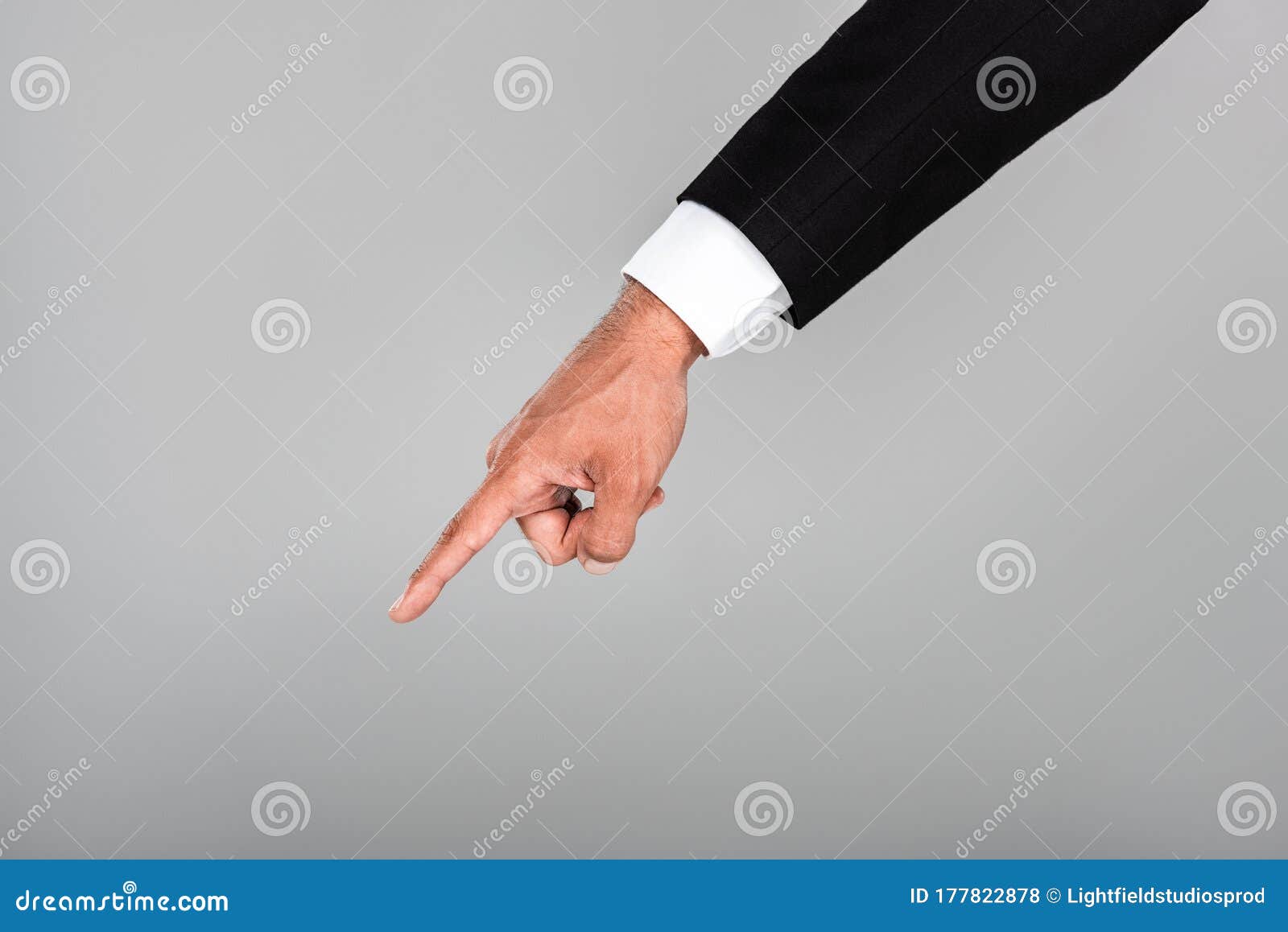 View of Businessman Pointing with Finger Isolated on Grey Stock Photo ...