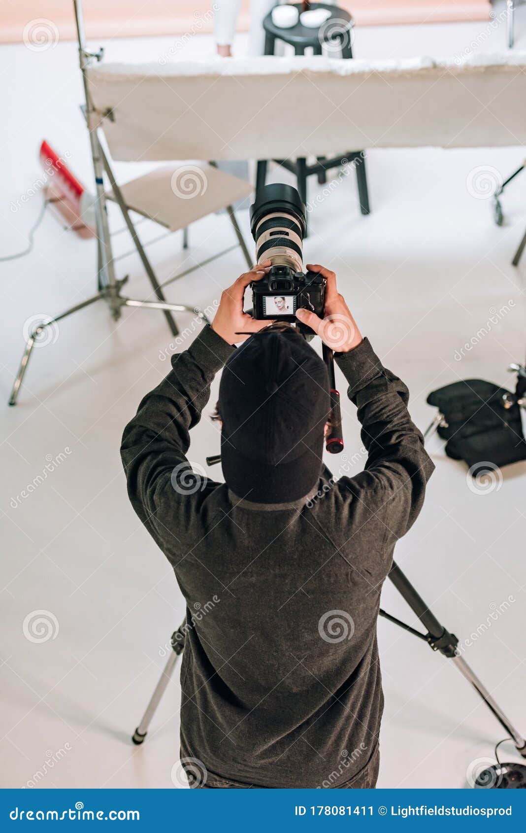 View of Cameraman Looking at Camera Display in Photo Studio Stock Image ...