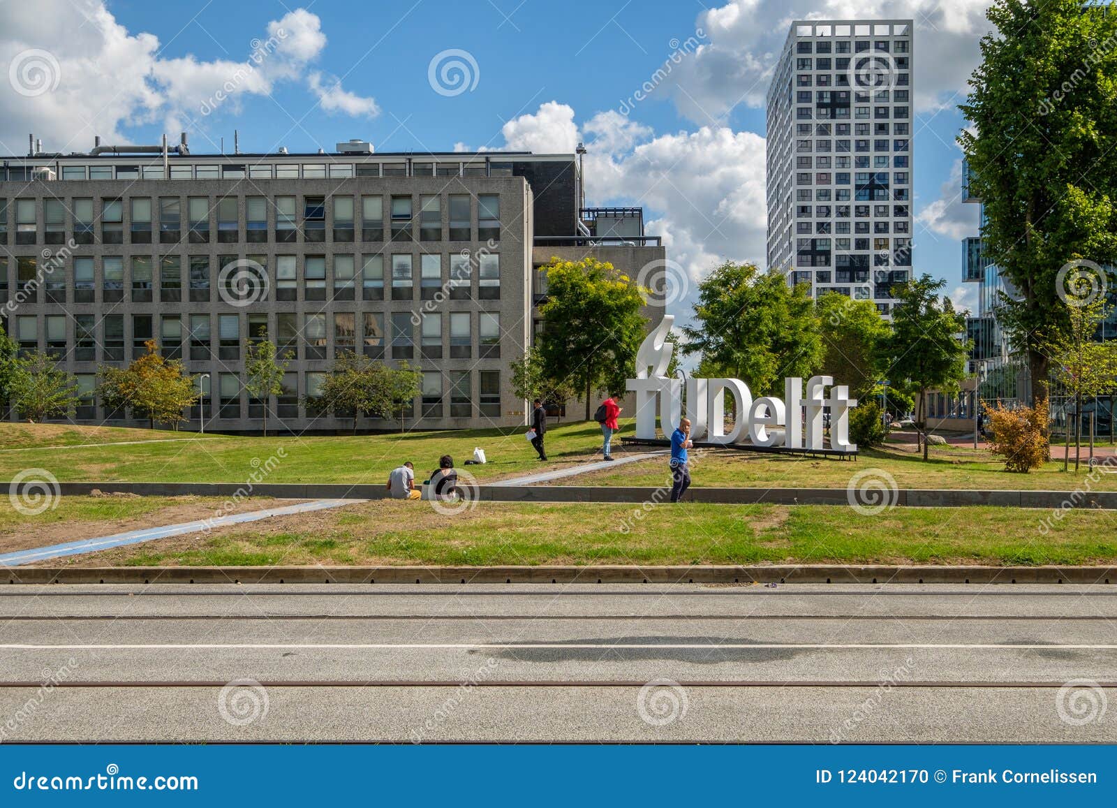 People in Front of the Logo of the Delft University, Netherlands ...