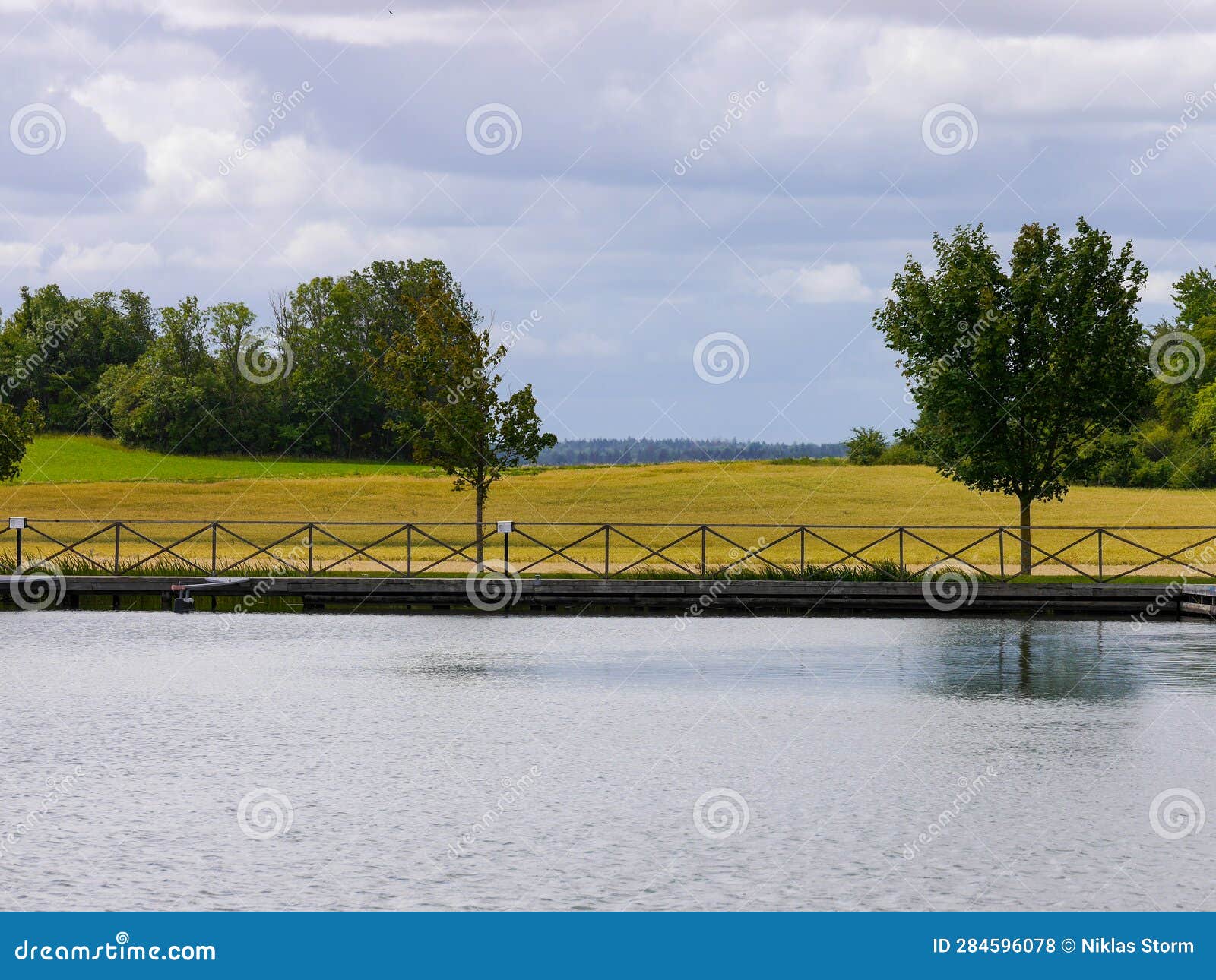 View of Canal Next To a Field Stock Photo - Image of traveling, outdoor ...