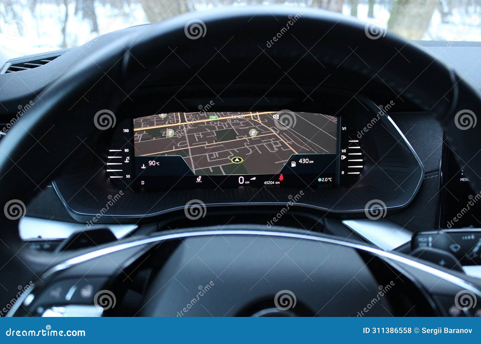 View of the Car Navigation Display with City Map through the Steering ...