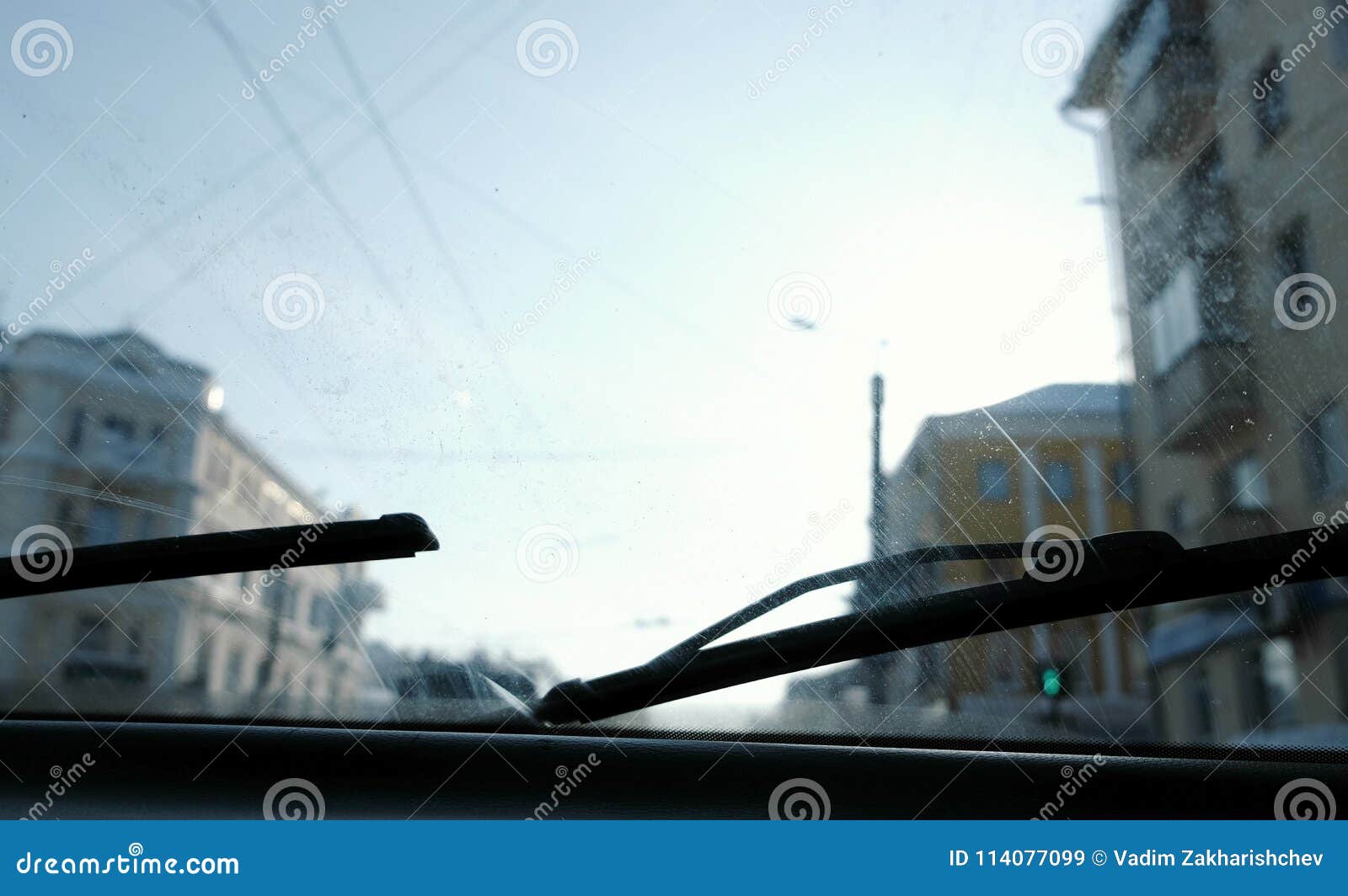 View from the Car To the City. Focus on the Dirty Windshield. the ...