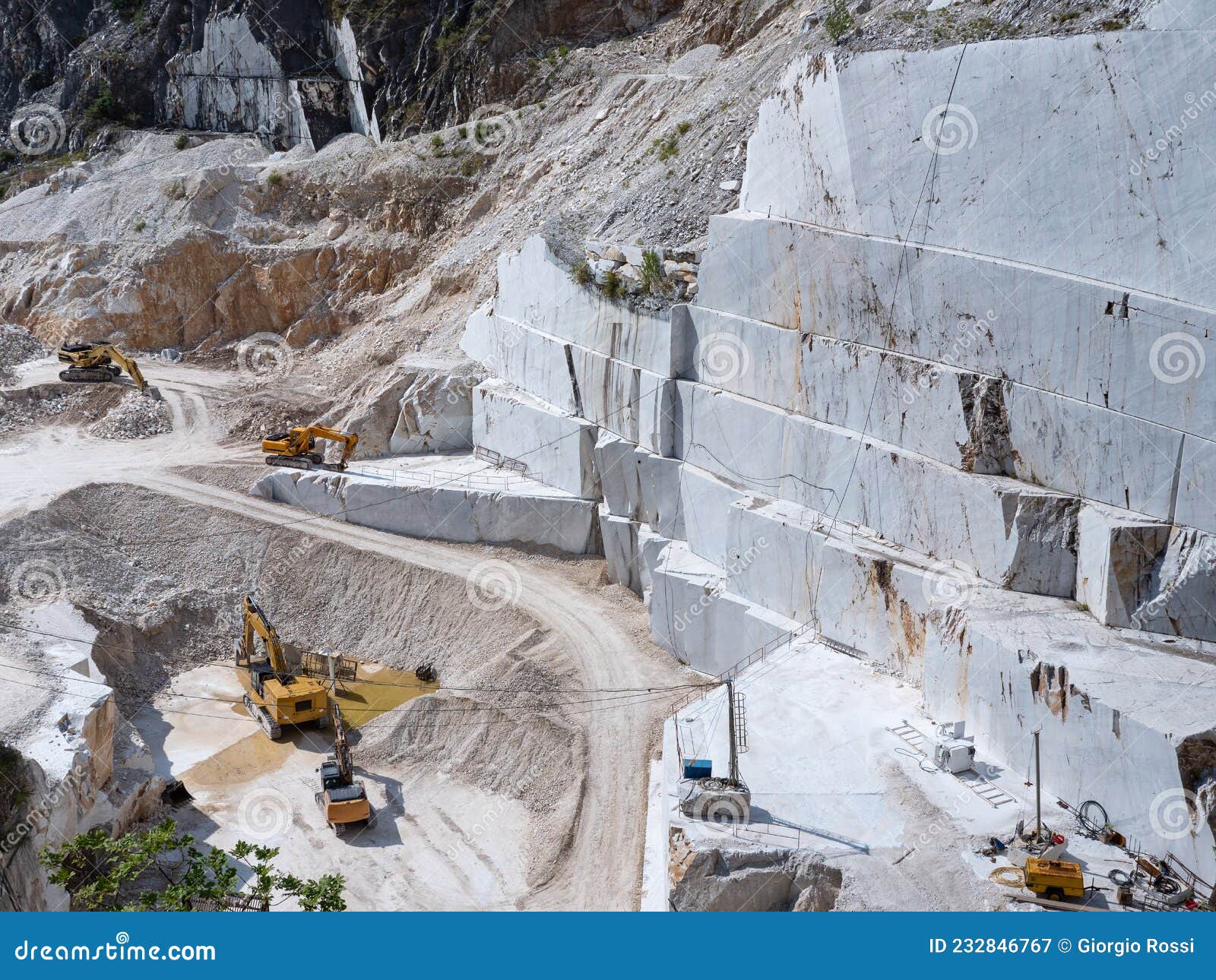 View of the Carrara Marble Quarries with Excavation Vehicles Ready for ...