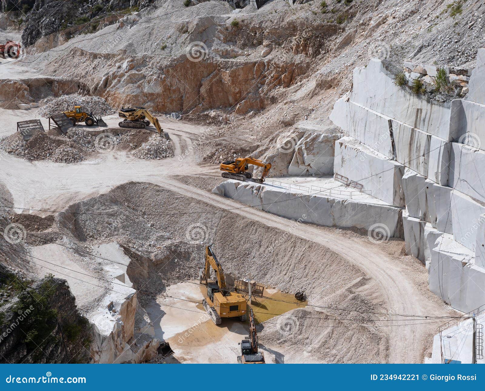 View of the Carrara Marble Quarries with Excavation Vehicles Ready for ...