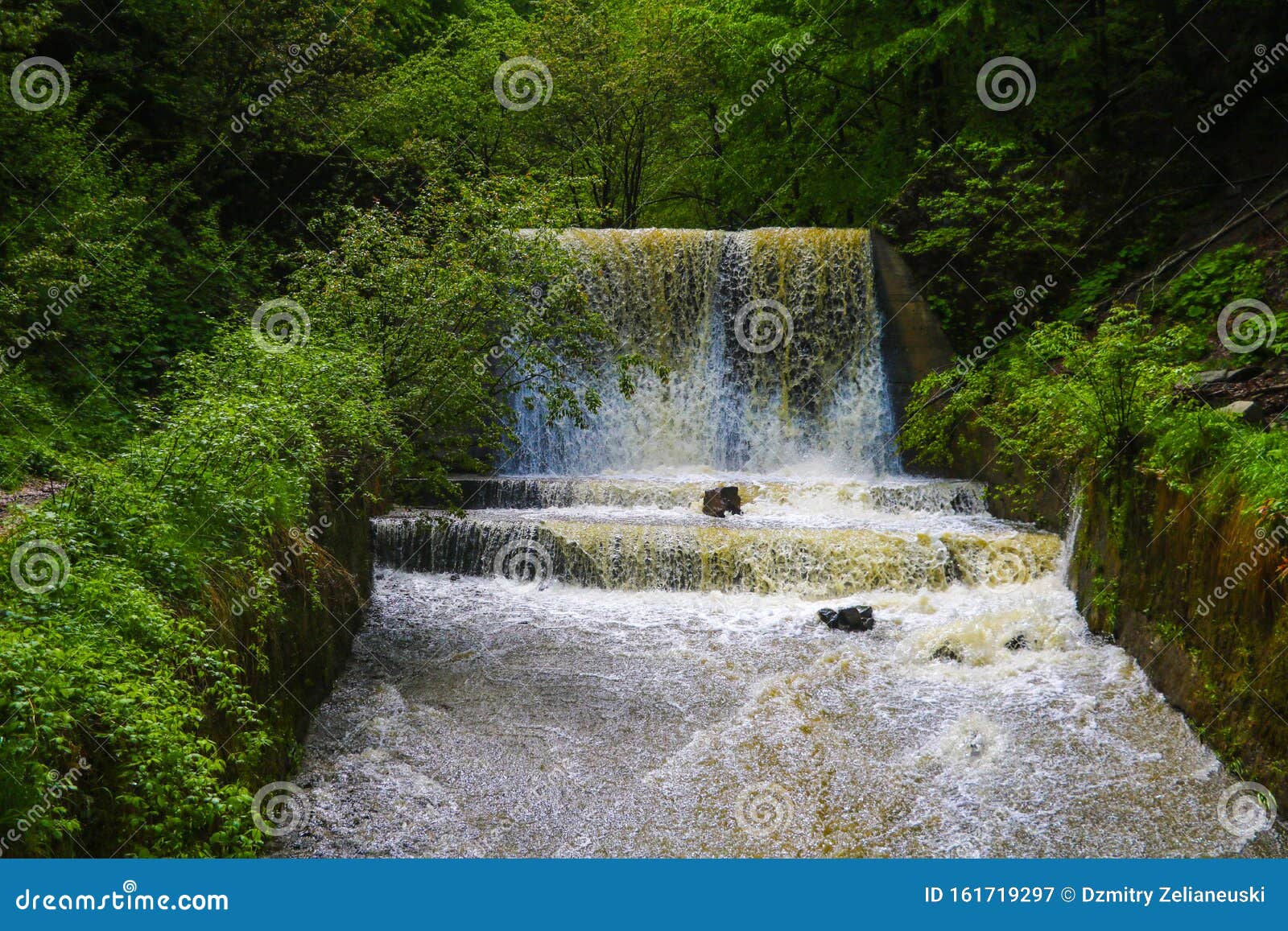 View of the Cascade of Water in the Form of Small Waterfalls Surrounded ...