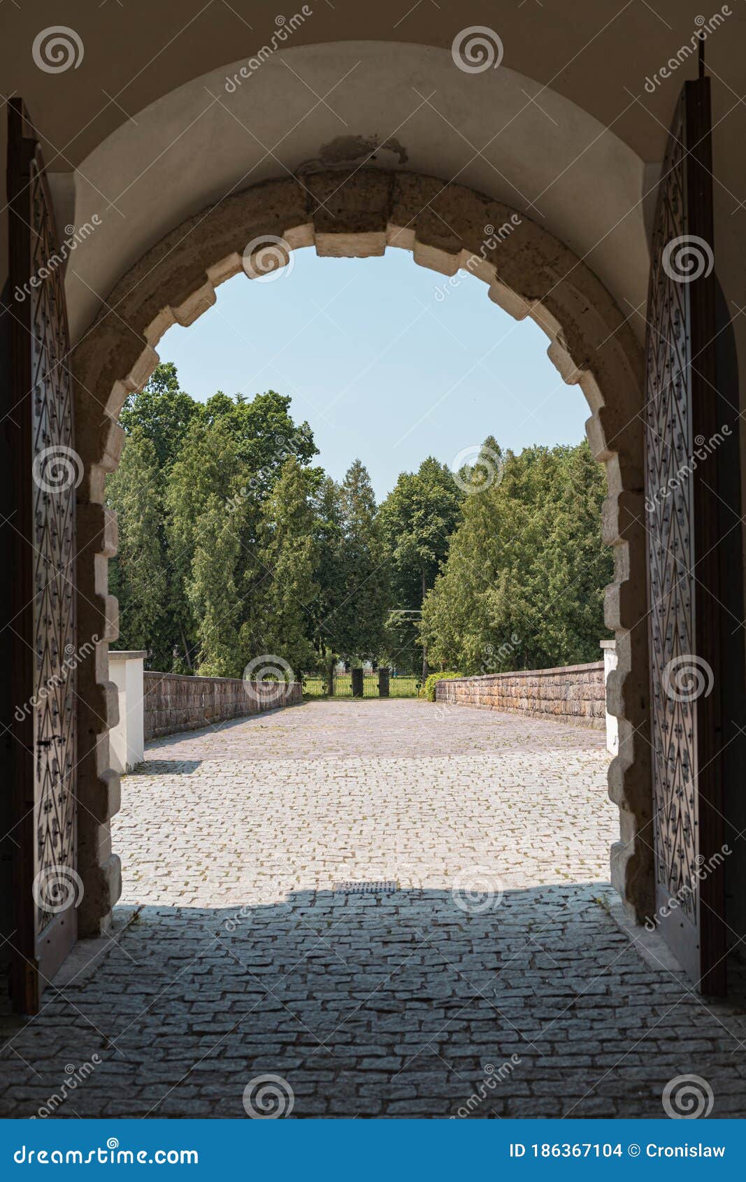 View on a Castle Grounds Bridge through a Entrance Gate Stock Photo ...