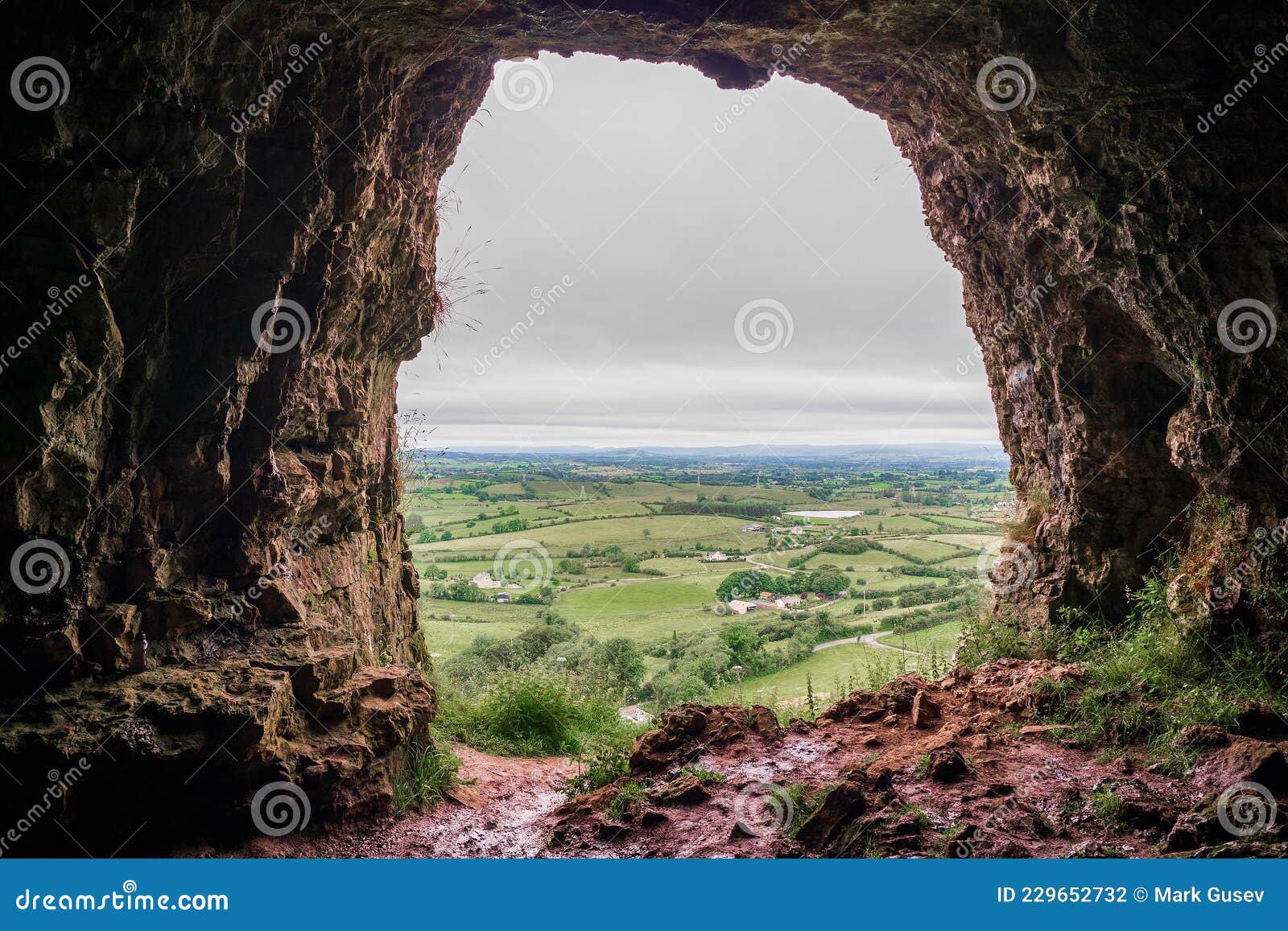 View from a Cave on a Beautiful Scenery. Cloudy Sky. Natural Frame ...