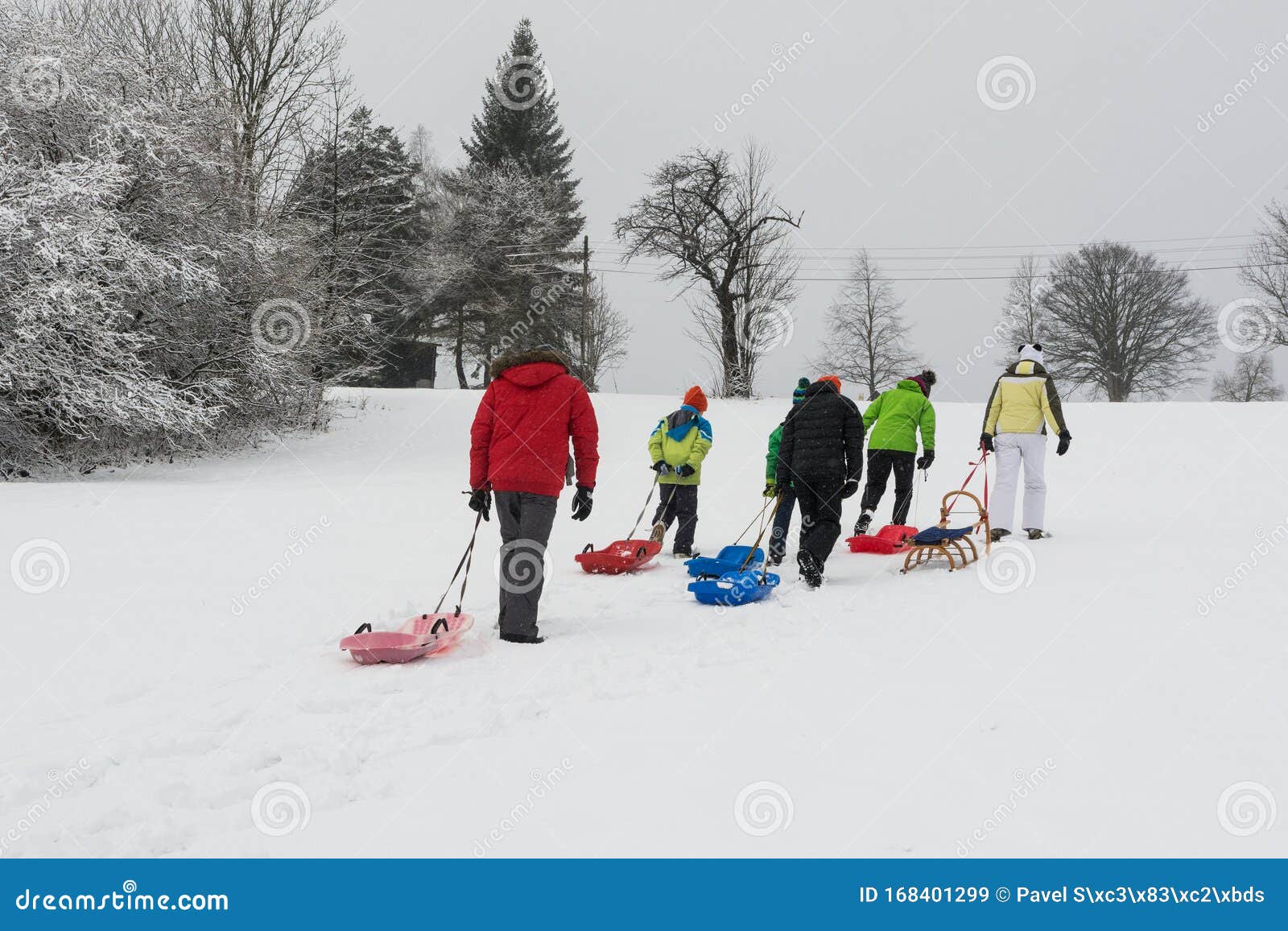 Children Pulling Sled on Snowy Hill Stock Image - Image of group, view ...
