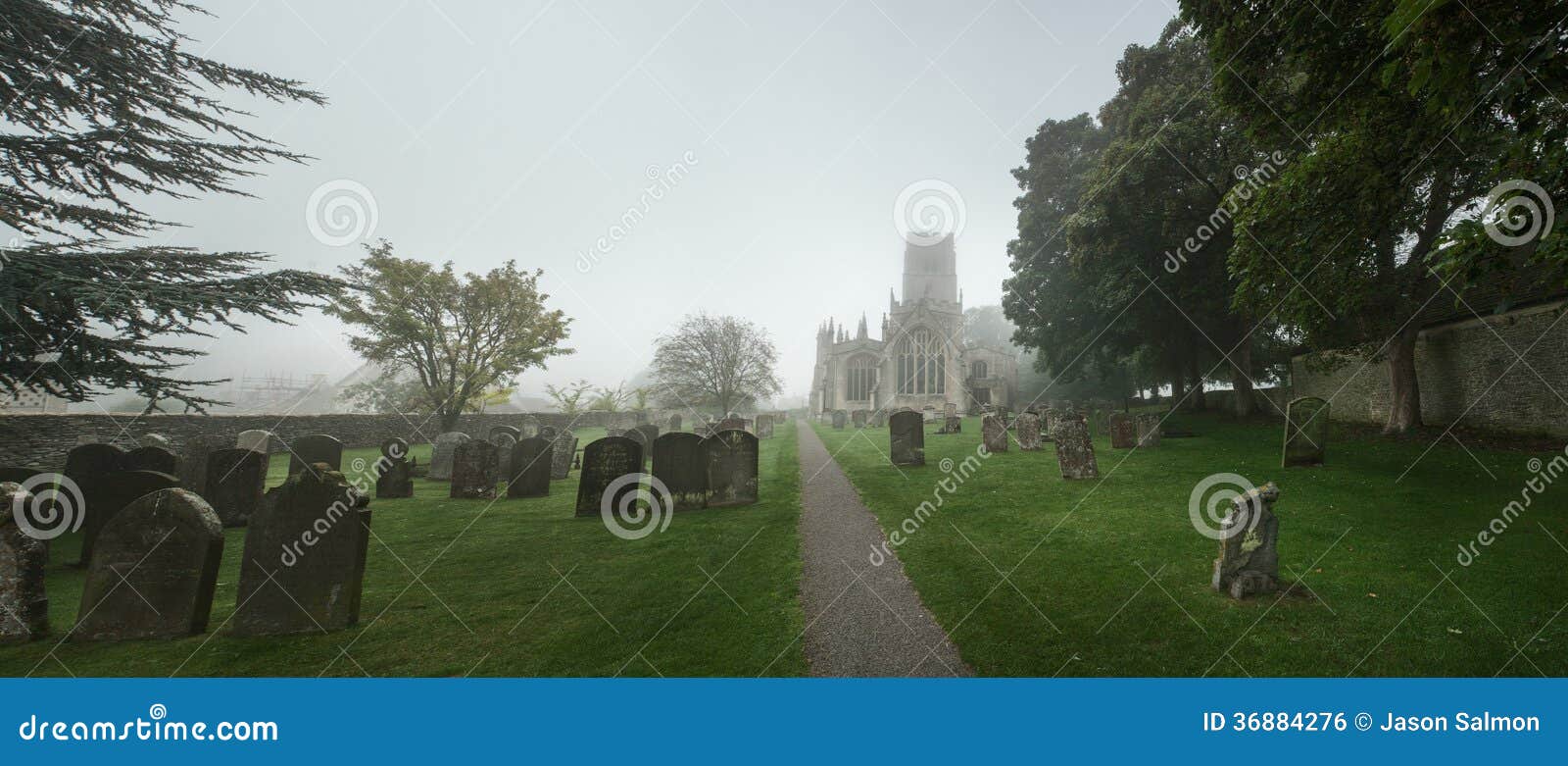 View of a Church through a Graveyard on a Misty Morning, England Stock ...