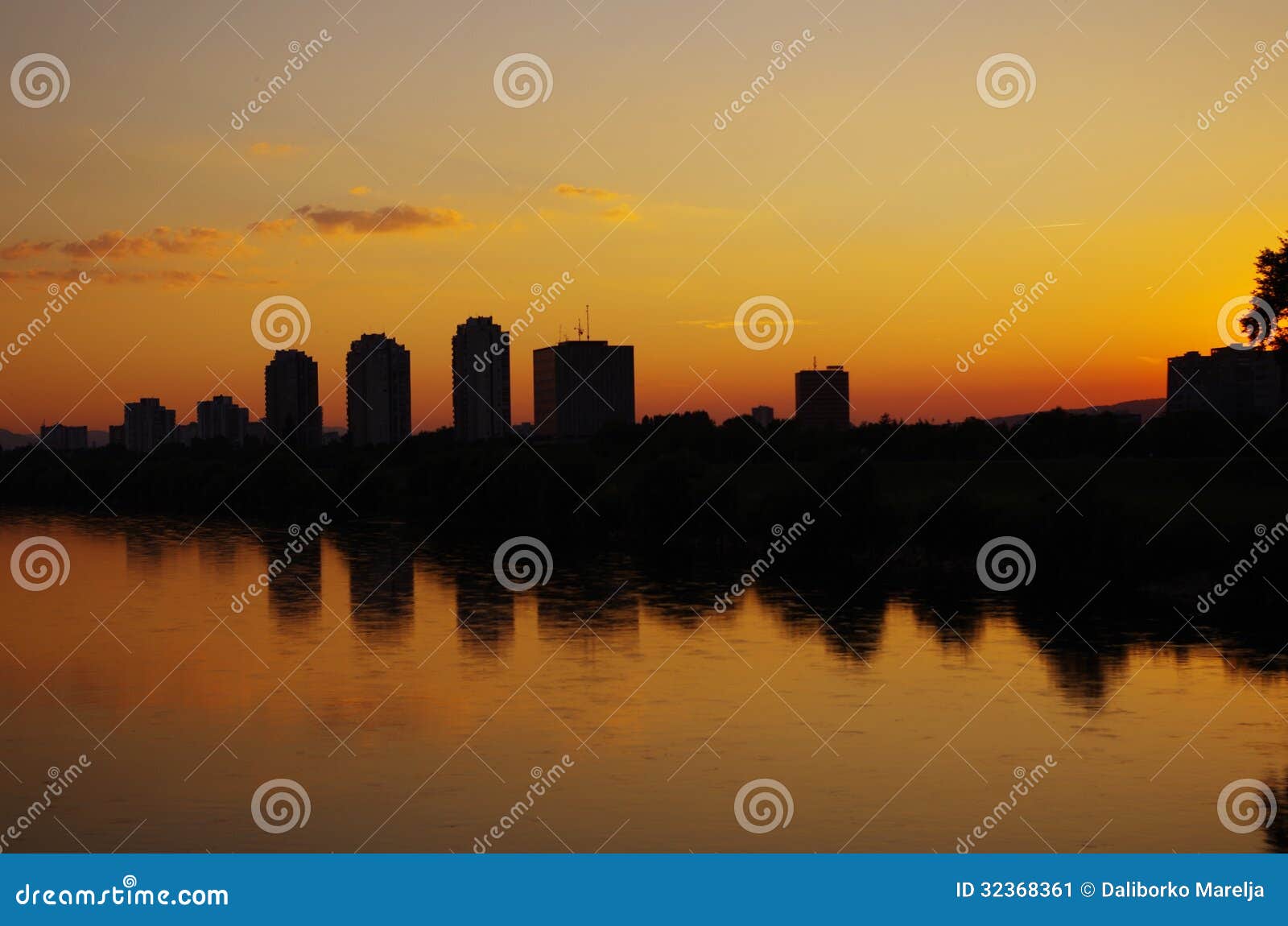 View of the City Across the River in the Evening. Stock Image - Image ...