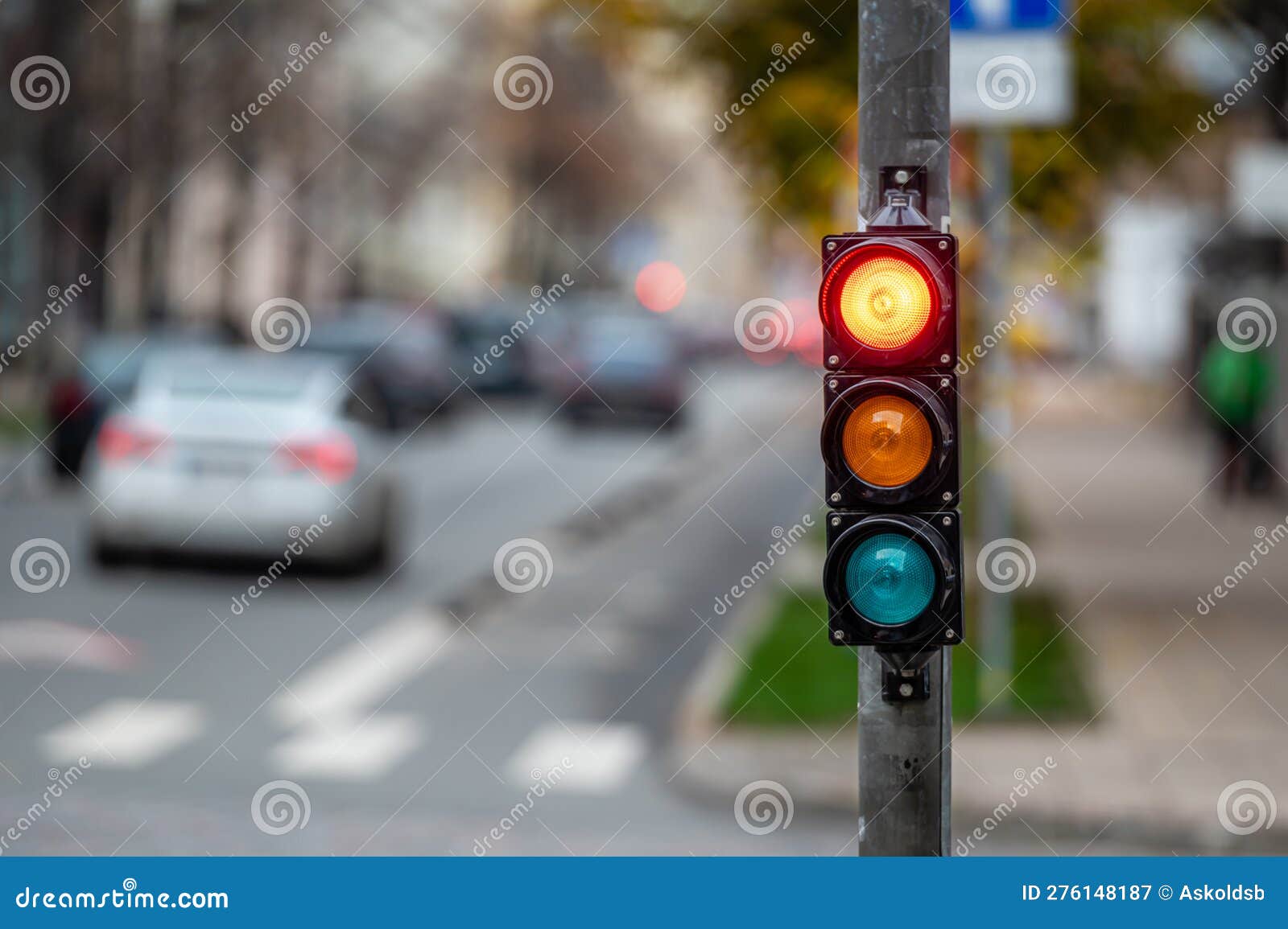 View of City Traffic with Traffic Lights, in the Foreground a Traffic ...
