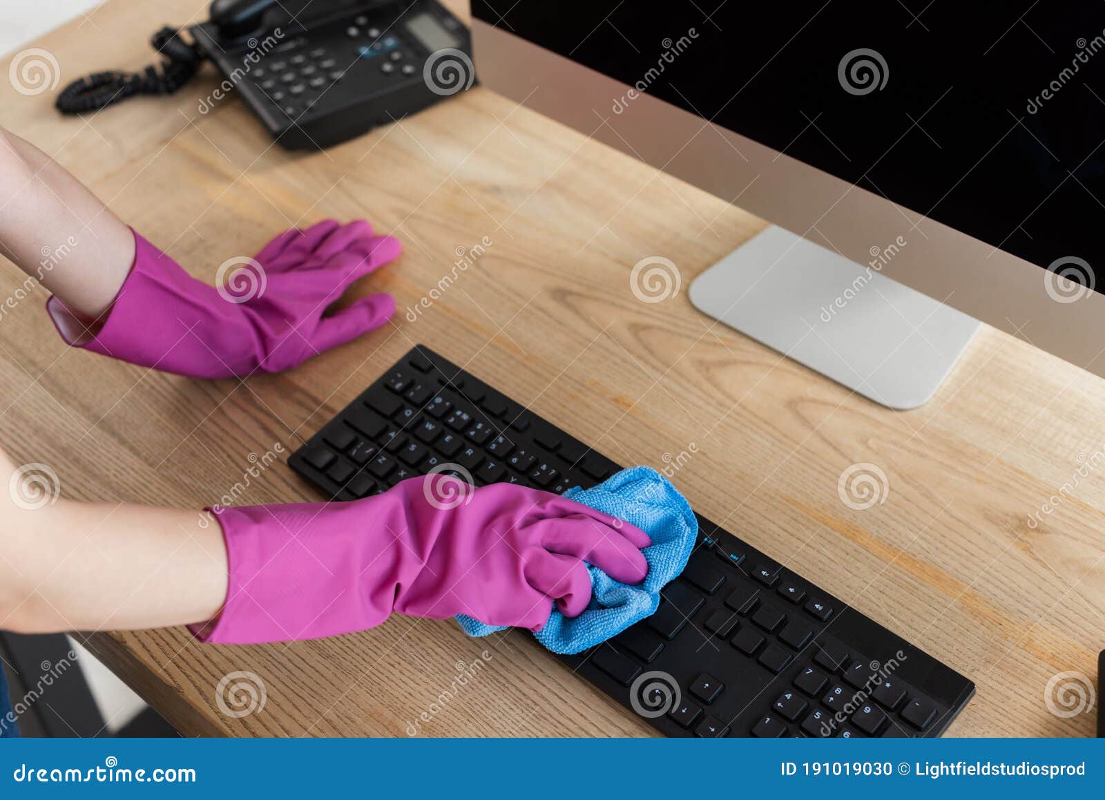 View of Cleaner Using Rag on Computer Keyboard on Table in Office Stock ...