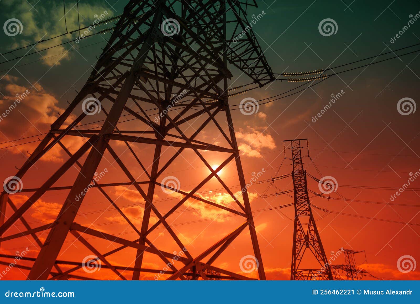 View of Clouds Hovering Over an Electrical Tower at Sunrise. Stock ...