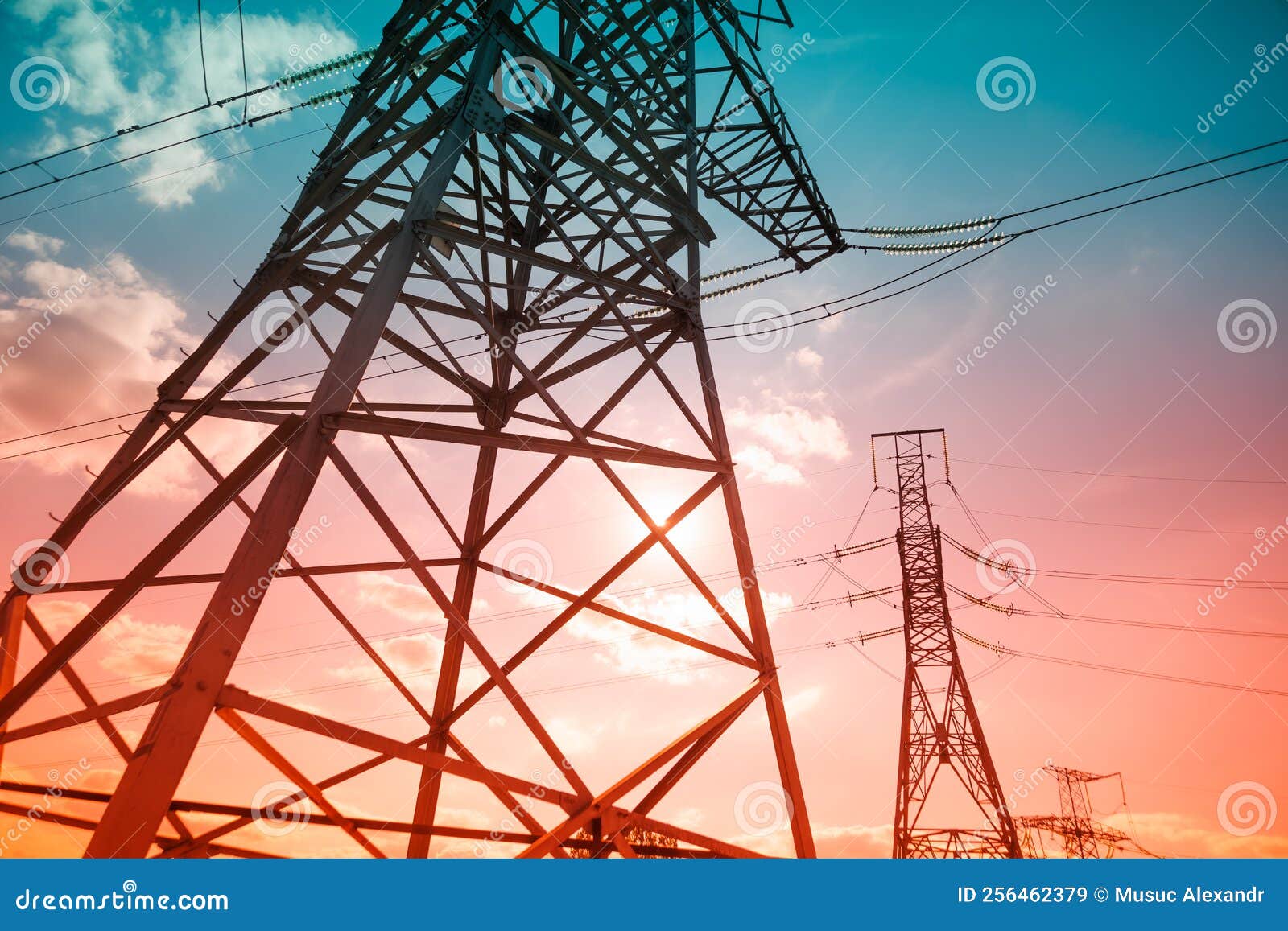 View of Clouds Hovering Over an Electrical Tower at Sunrise. Stock ...