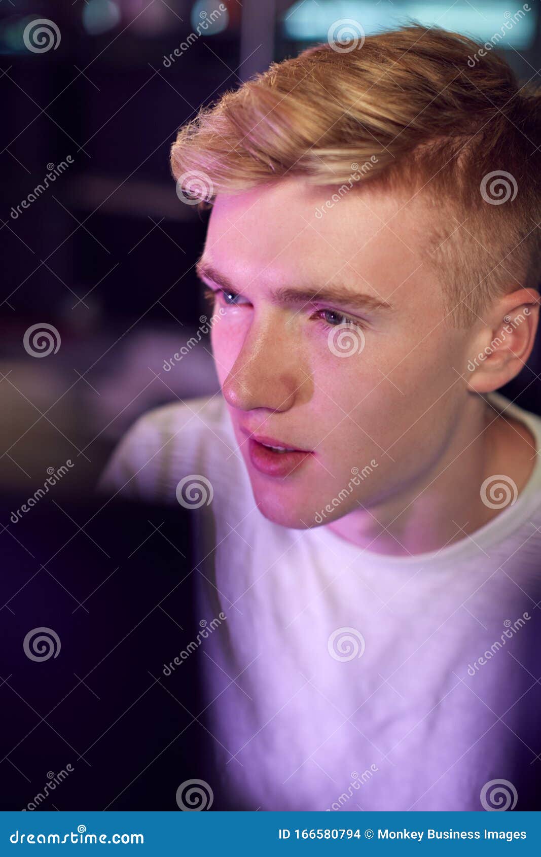 View between Computer Screens of Teenage Boy Gaming at Home Stock Photo ...