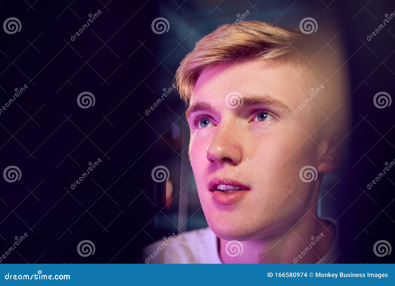 View between Computer Screens of Teenage Boy Gaming at Home Stock Photo ...