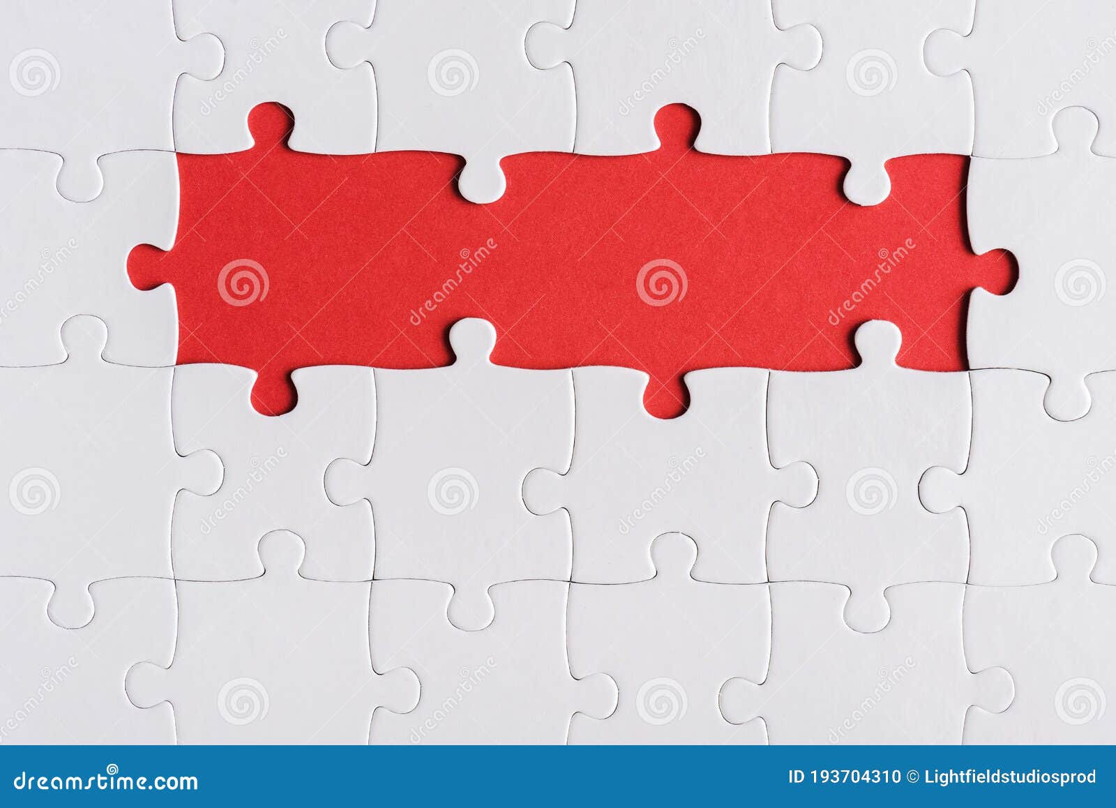 View of Connected Jigsaw Puzzle Pieces Isolated on Red Stock Photo ...