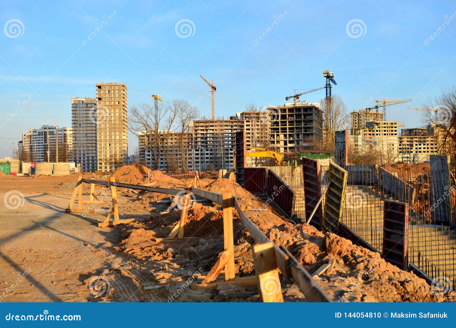 View of the Construction Site with Cranes, Concrete Formwork in the Pit ...