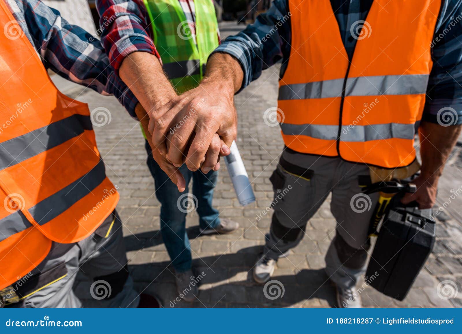 View of Constructors Putting Hands Together Outside Stock Image - Image ...