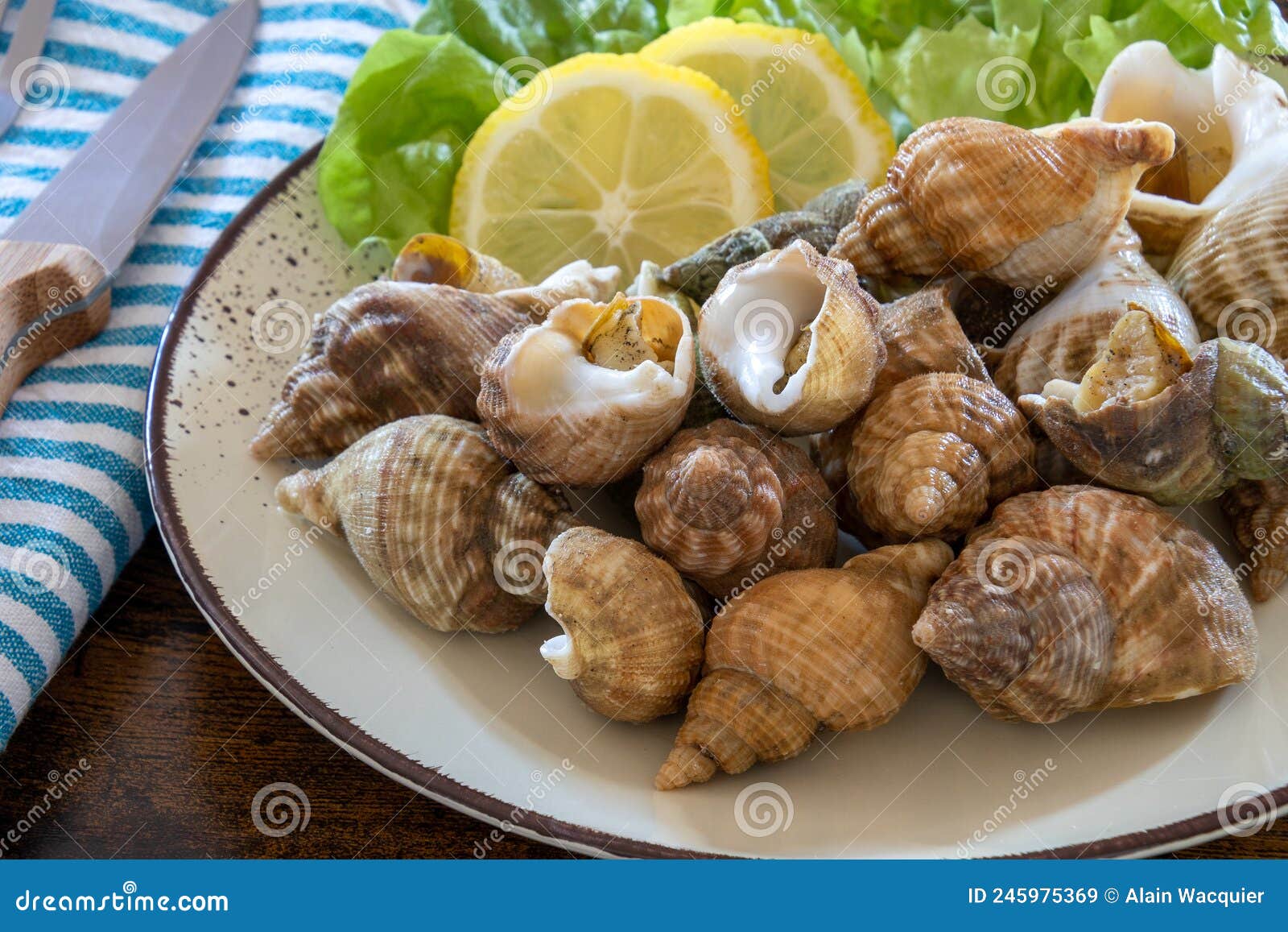 Cooked Whelks on a Plate with Salad and Lemon Stock Image - Image of ...