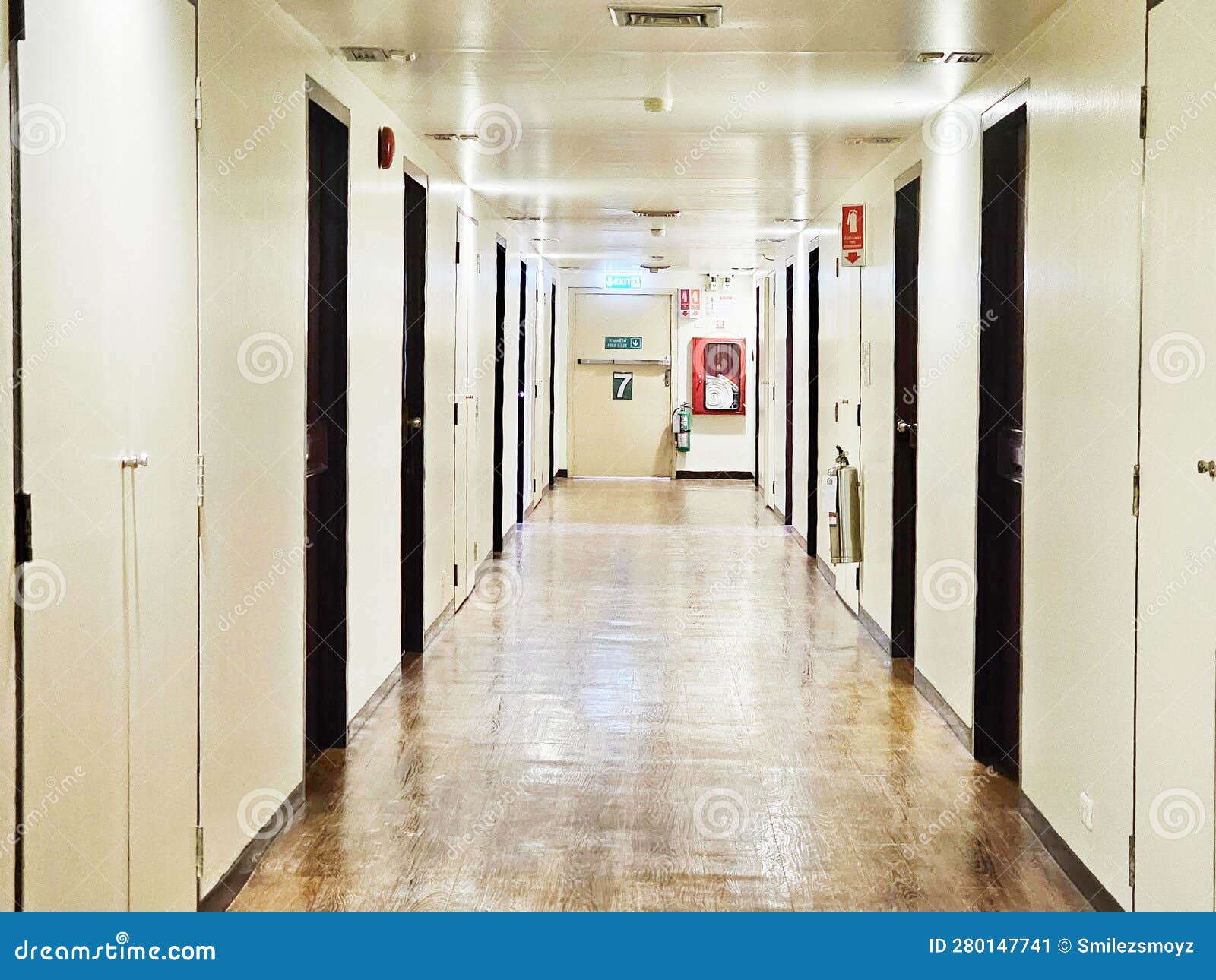 Hotel Corridor Hallway Has Signs and Fire Escape Doors in the Building ...