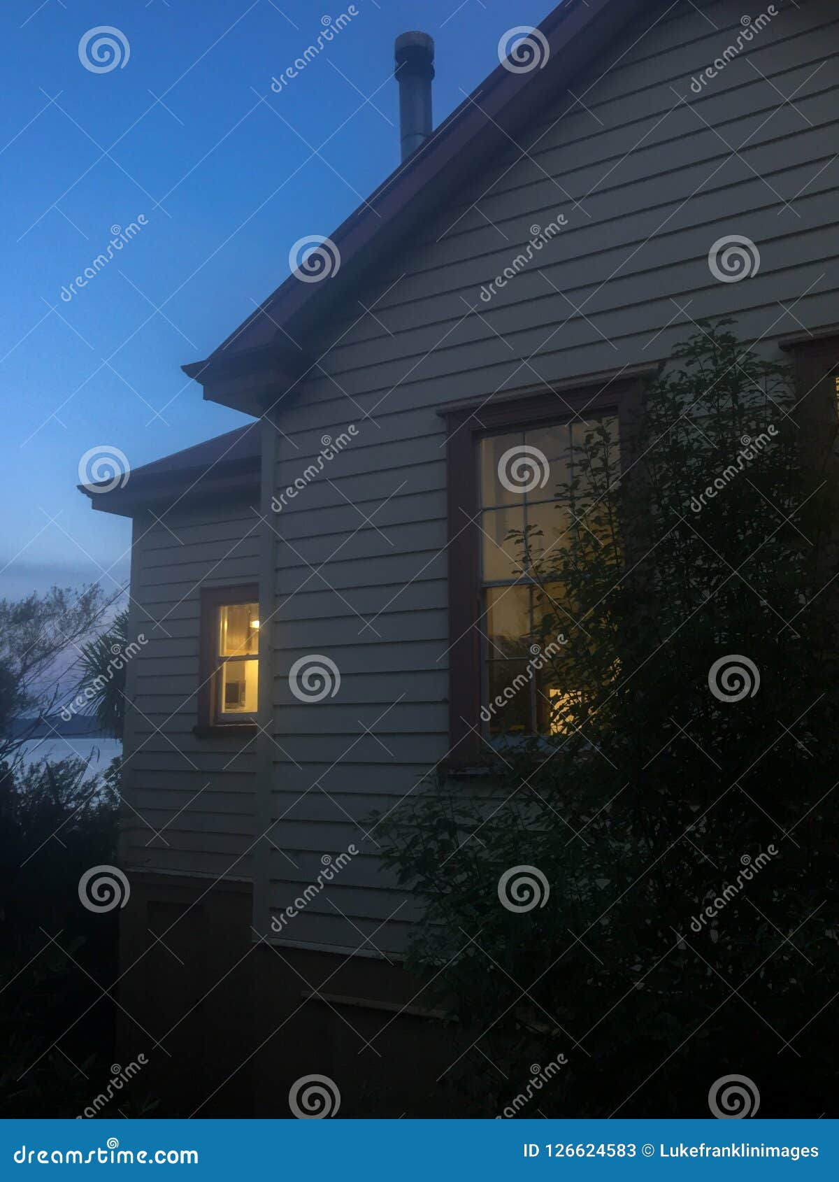 View of a Cottage at Sunset Stock Image - Image of blue, cabin: 126624583