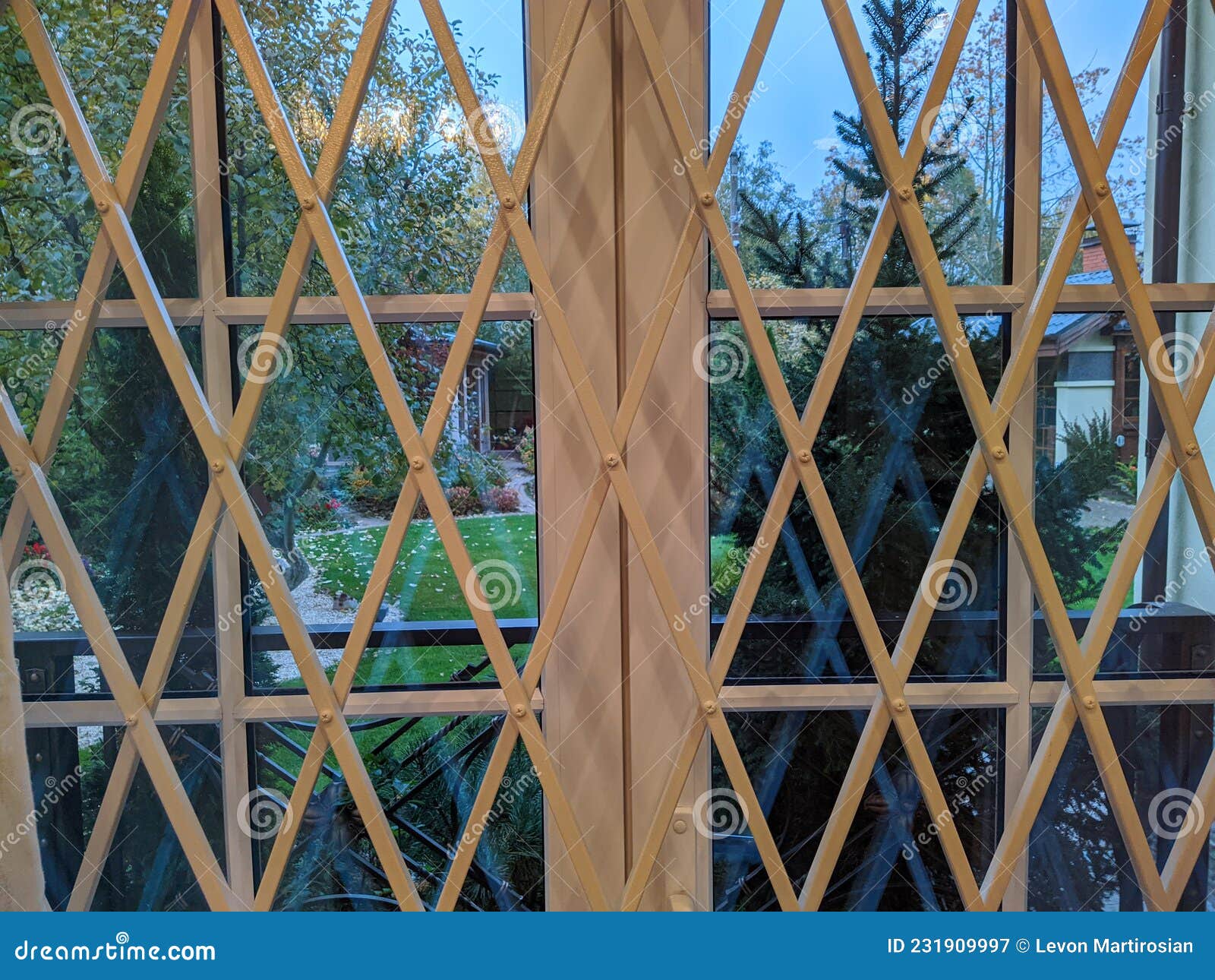 View of the Courtyard through a Window with Bars. Stock Image - Image ...